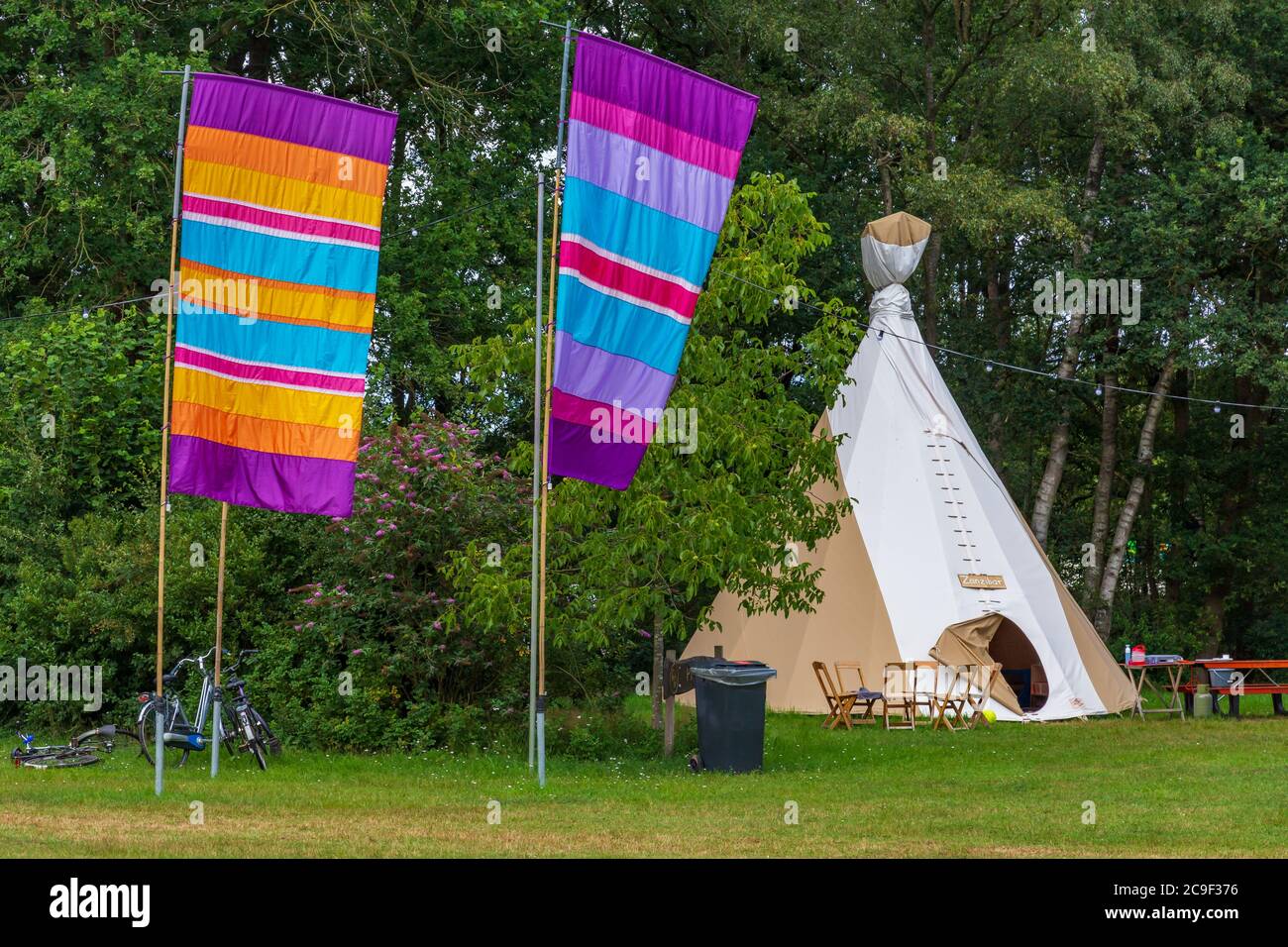 Colorful campsite with teepee or wigwam tents in green area Stock Photo ...