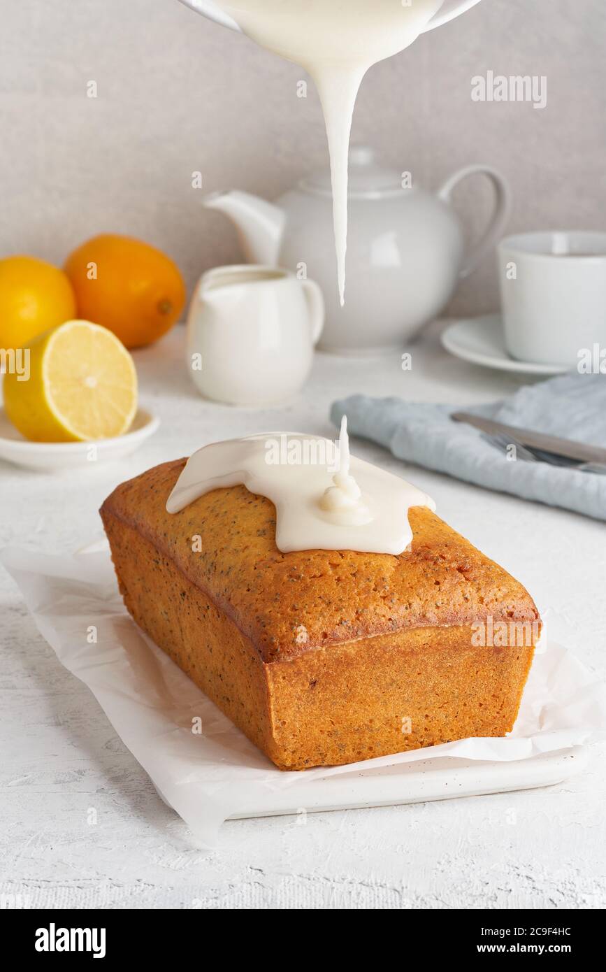 Lemon bread coated with sugar sweet icing. Whole loaf. White background ...