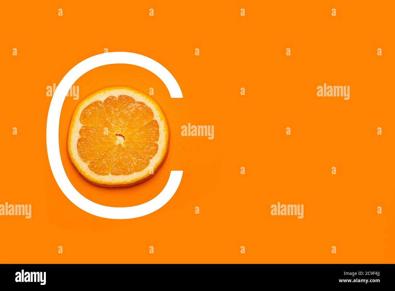 A slice of orange on an orange background with C letter drawed Stock ...