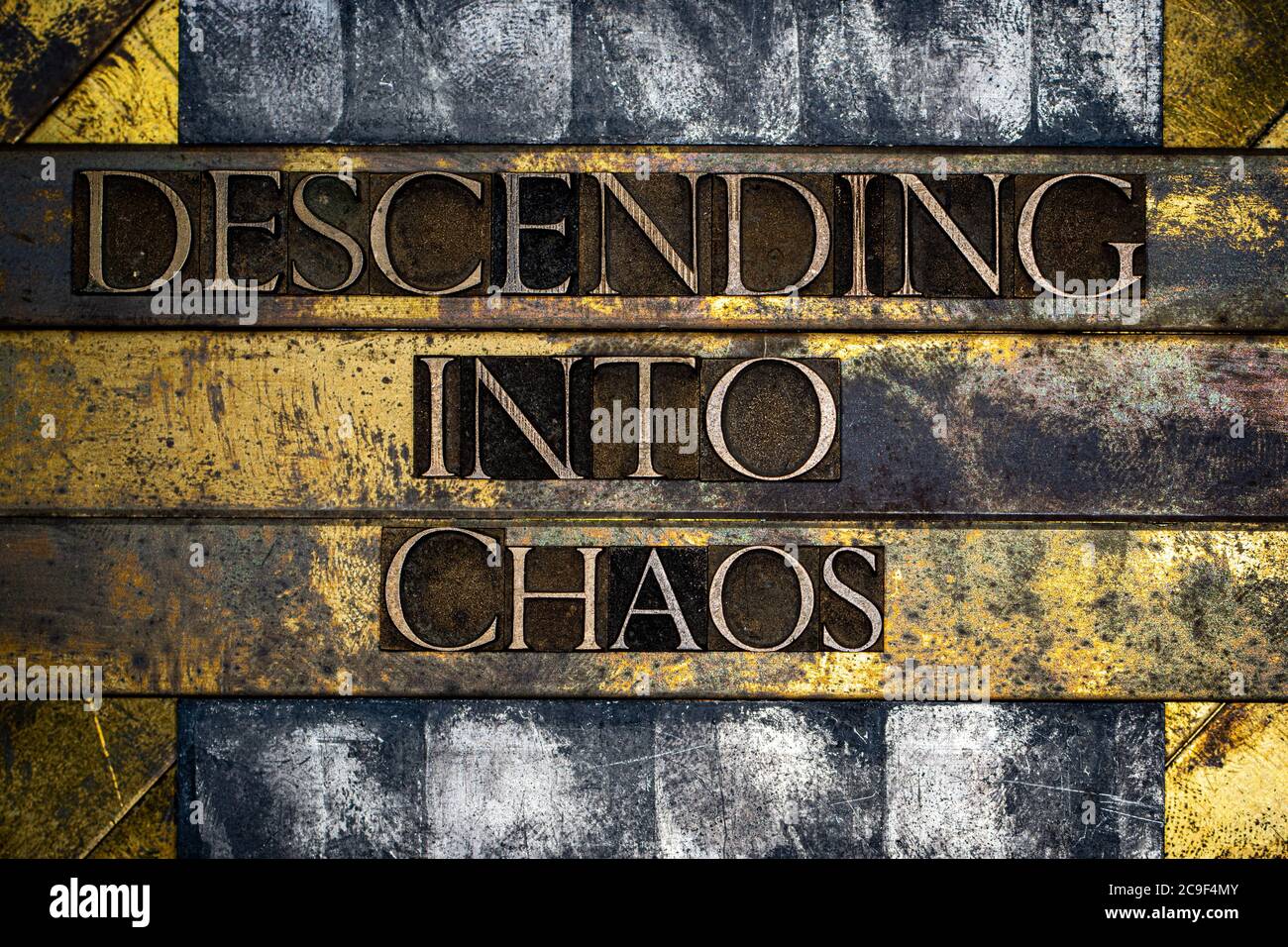 Descending Into Chaos text formed with real authentic typeset letters ...