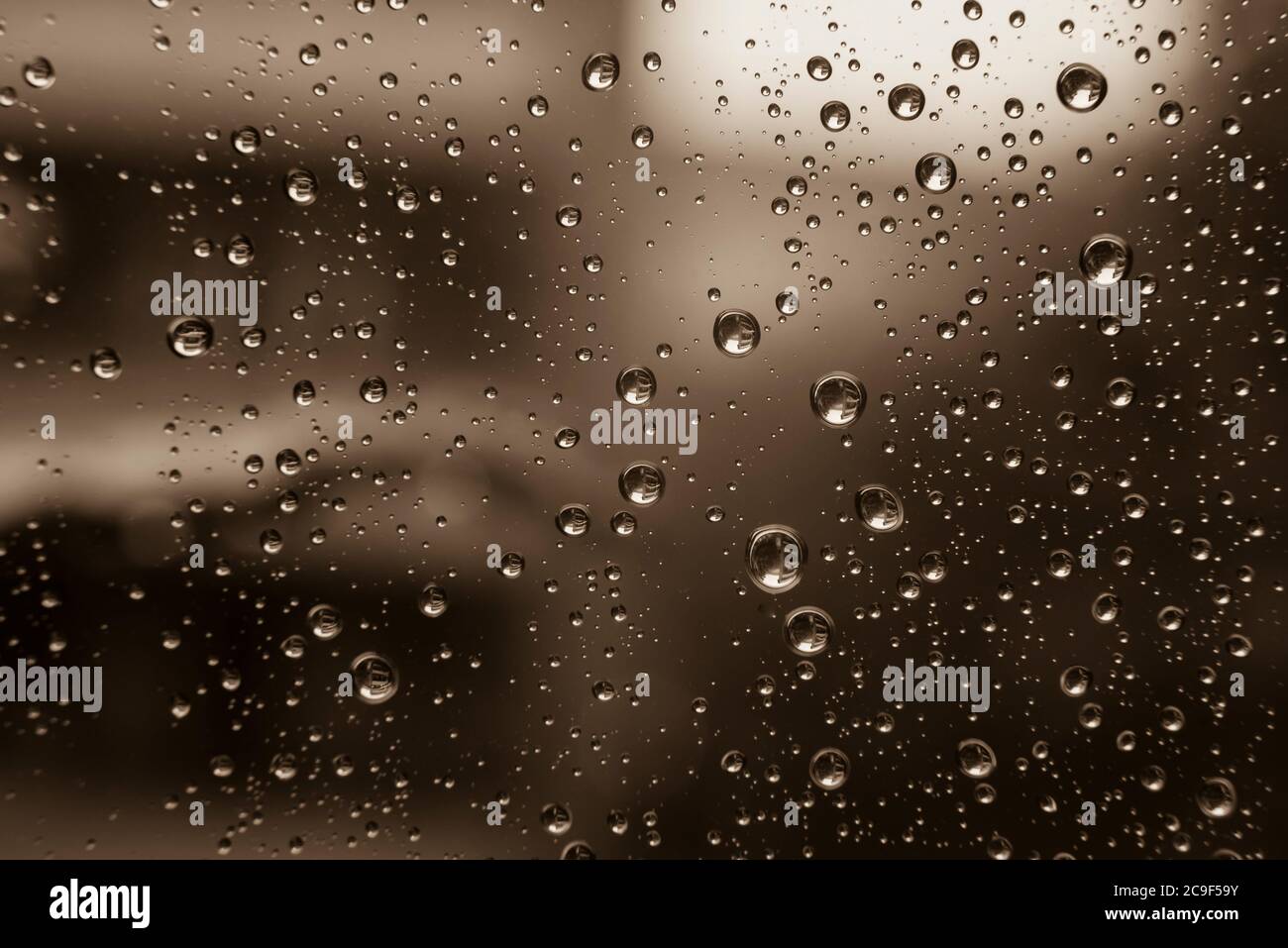 Drops of water on a window pane, raindrops on a window, abstract, black ...