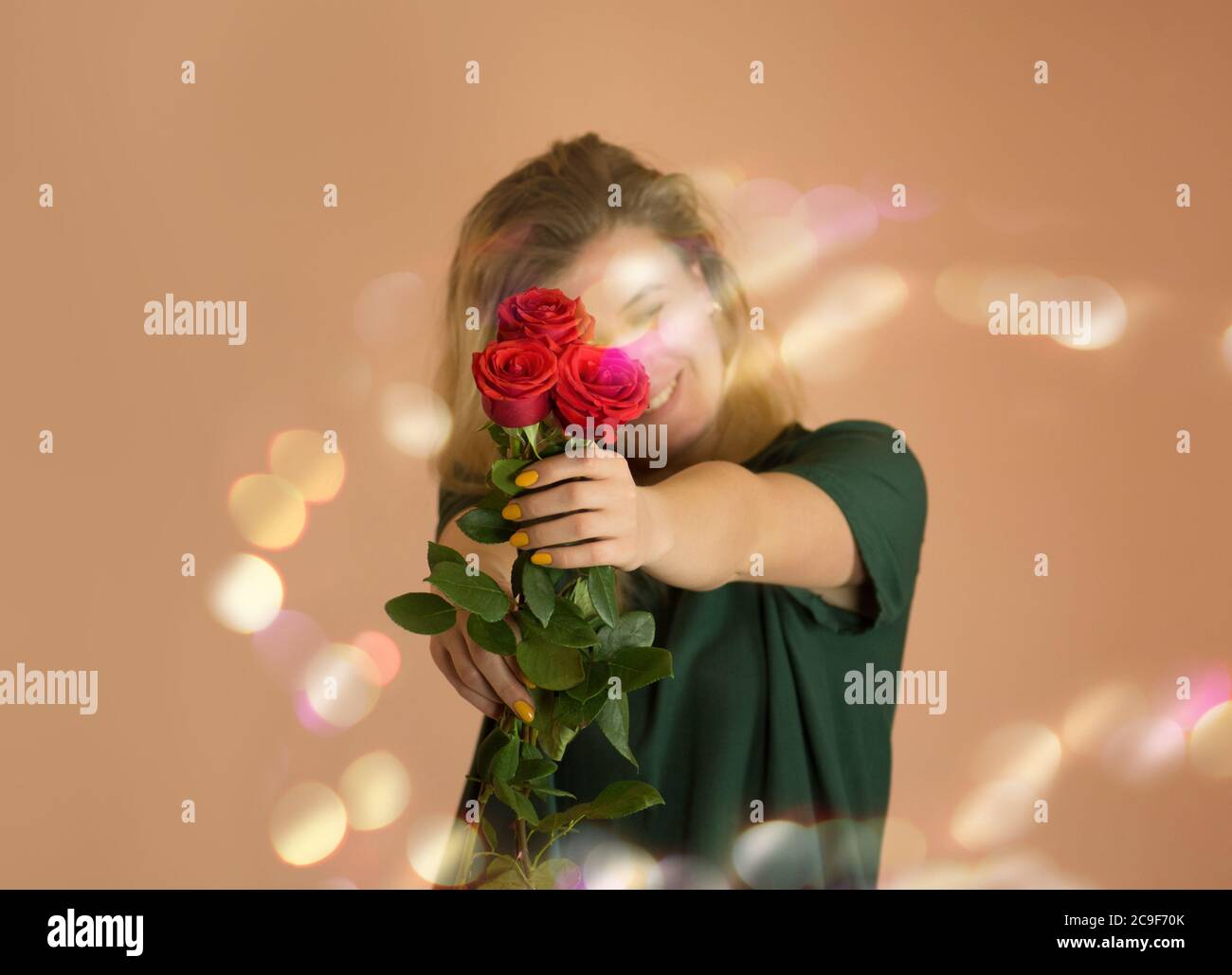 Girl with bouquet of red roses. Spring bouquet of red roses in womans ...