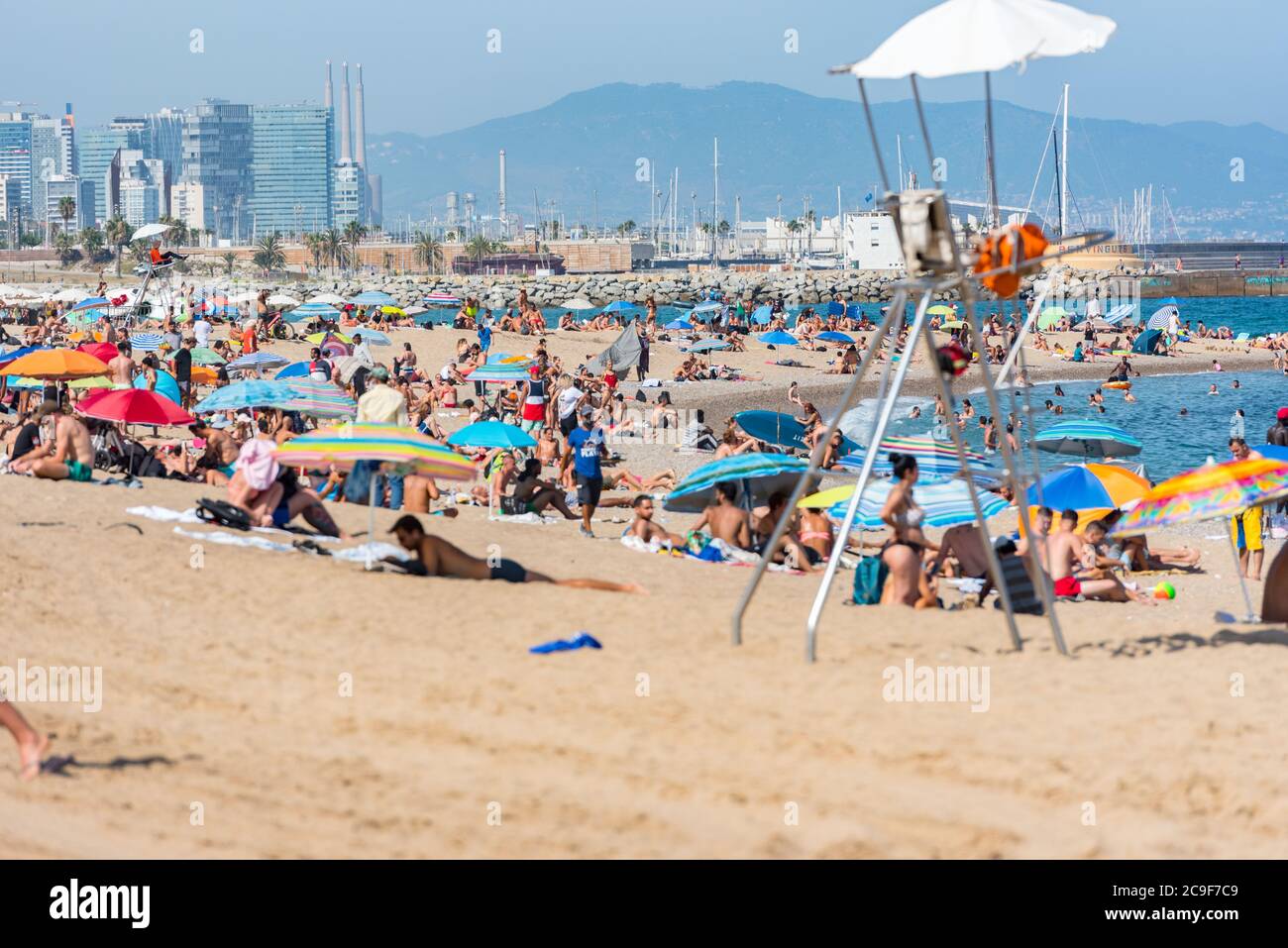 Barcelona, Spain - July 28 2020: People in the Barceloneta Beach after ...