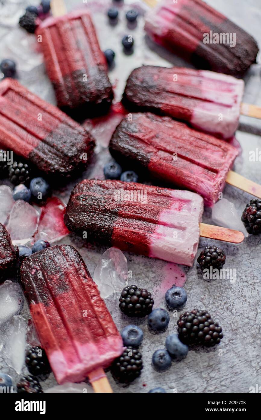 Homemade blackberry and cream ice-creams or popsicles with frozen ...