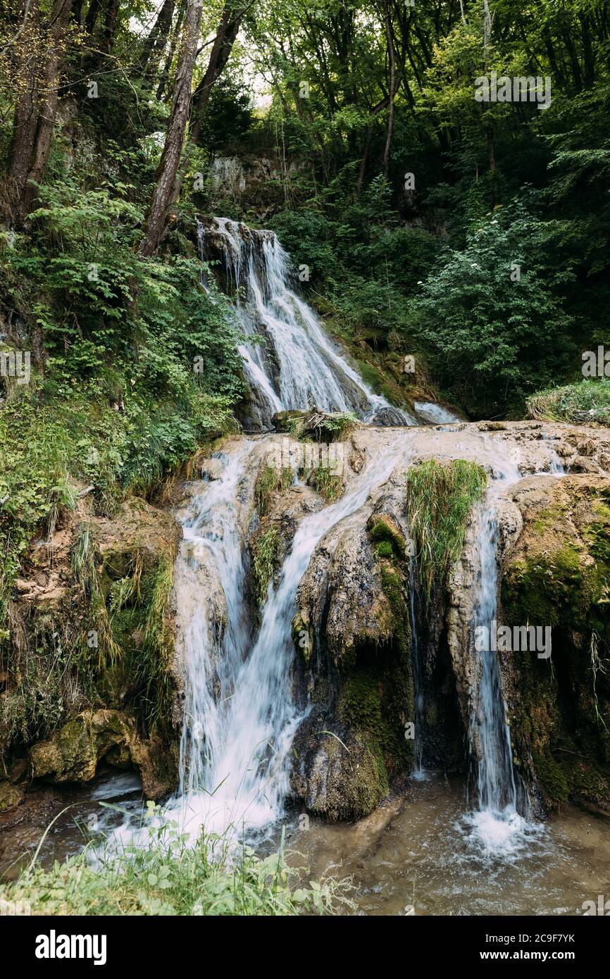 View of the beautiful waterfall in lush green forest Stock Photo - Alamy