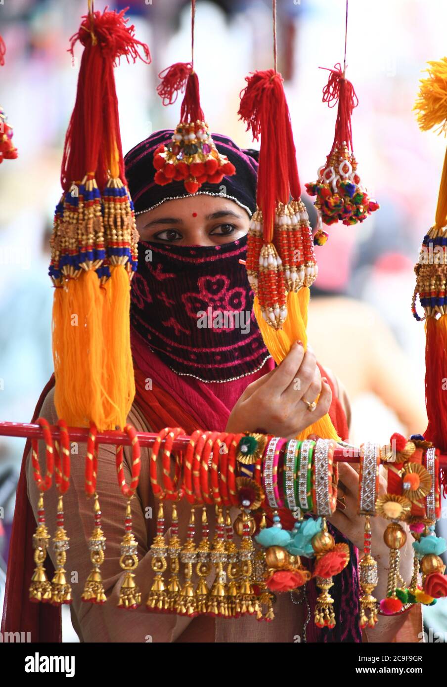 Beawar, Rajasthan, India, July 30, 2020: Young woman purchase Rakhi ...