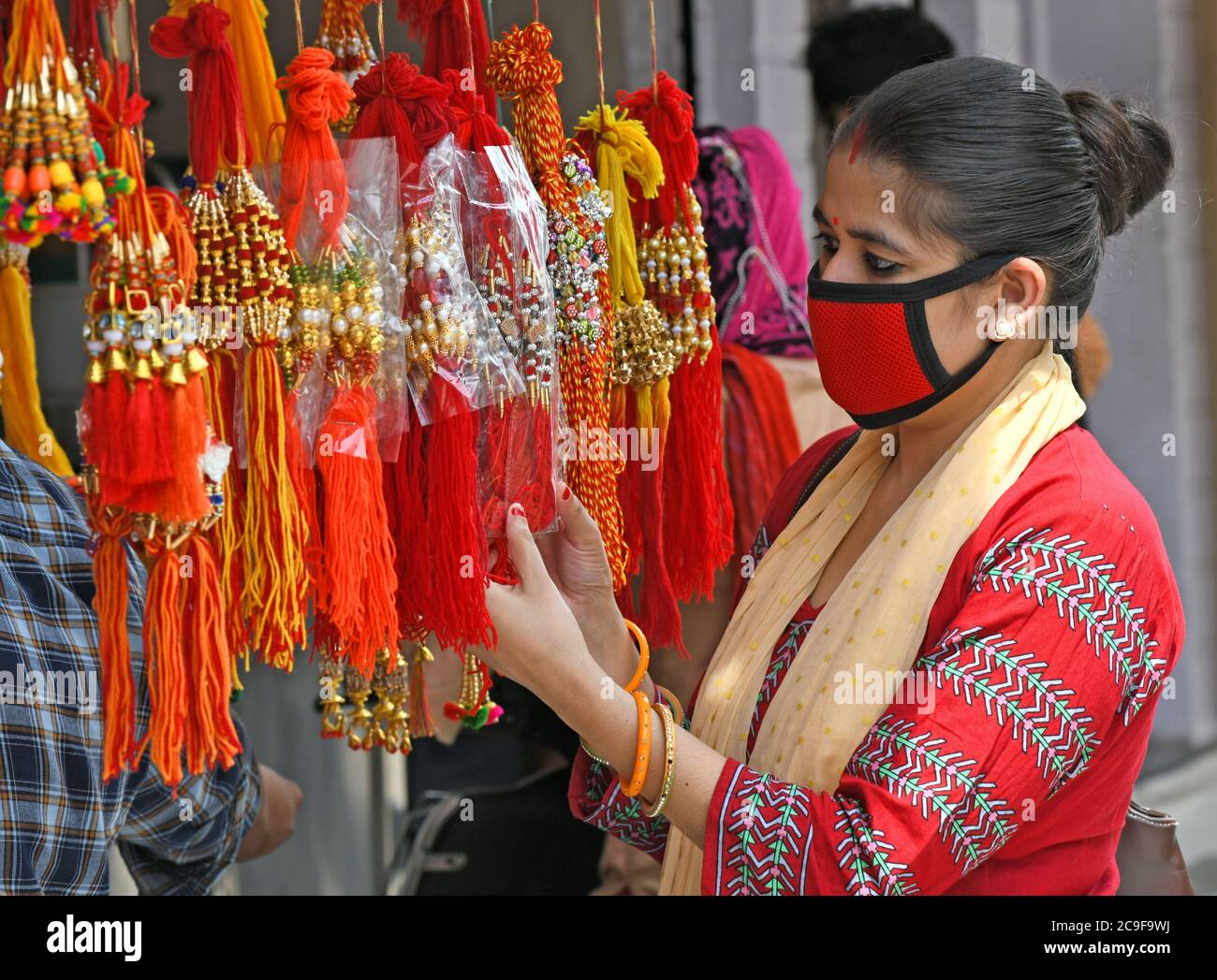 Beawar, Rajasthan, India, July 30, 2020: Young woman purchase Rakhi ...