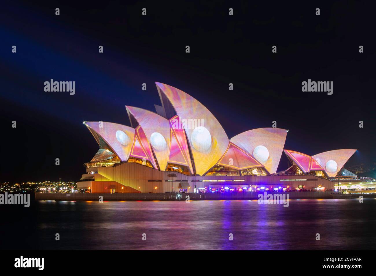 Sydney Opera House lit up with colours in winter Stock Photo - Alamy