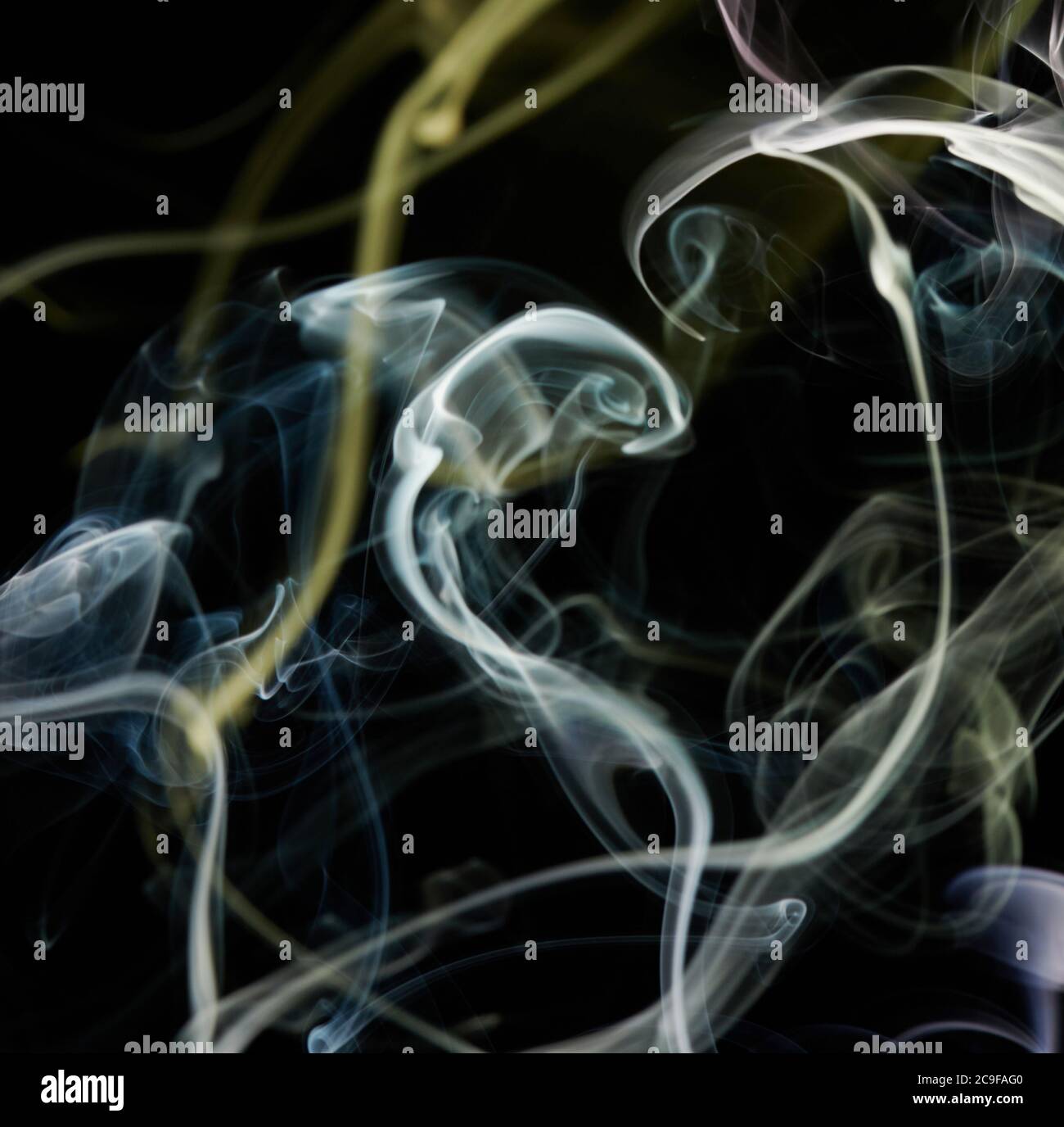 Abstract smoke curves flow on black isolated background Stock Photo - Alamy
