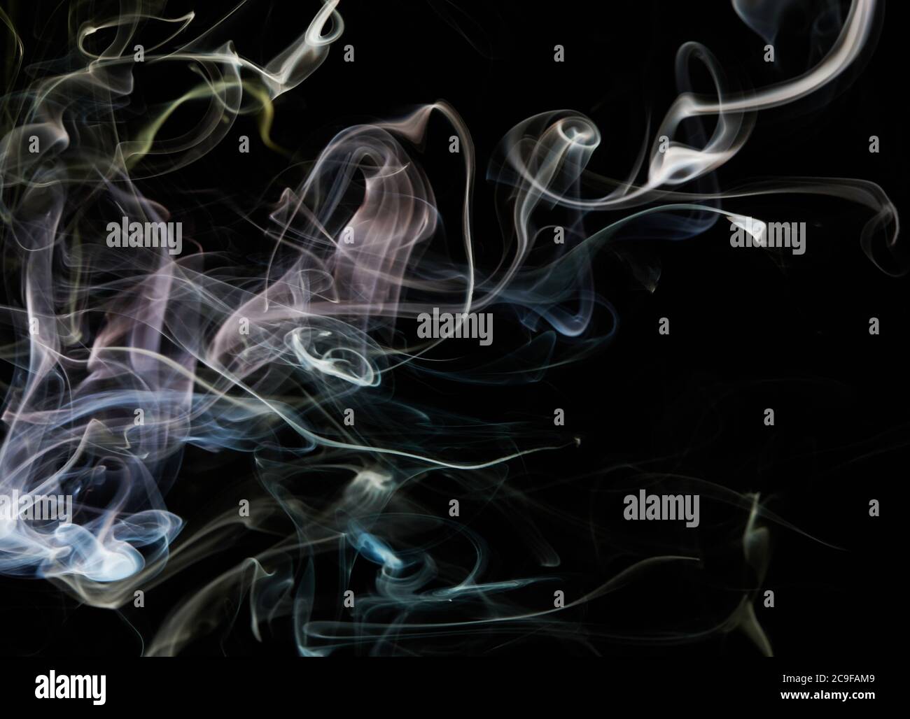 Colorful smoke line on black isolated background Stock Photo - Alamy