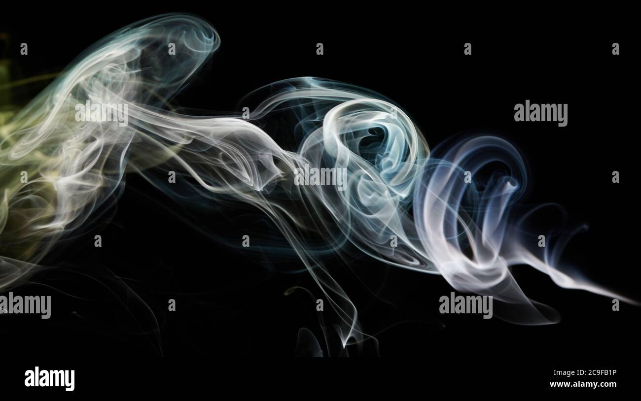 Colorful smoke curves abstract shape on black isolated background Stock ...