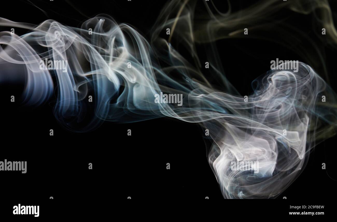 Smooth soft smoke swirl on black isolated background Stock Photo - Alamy