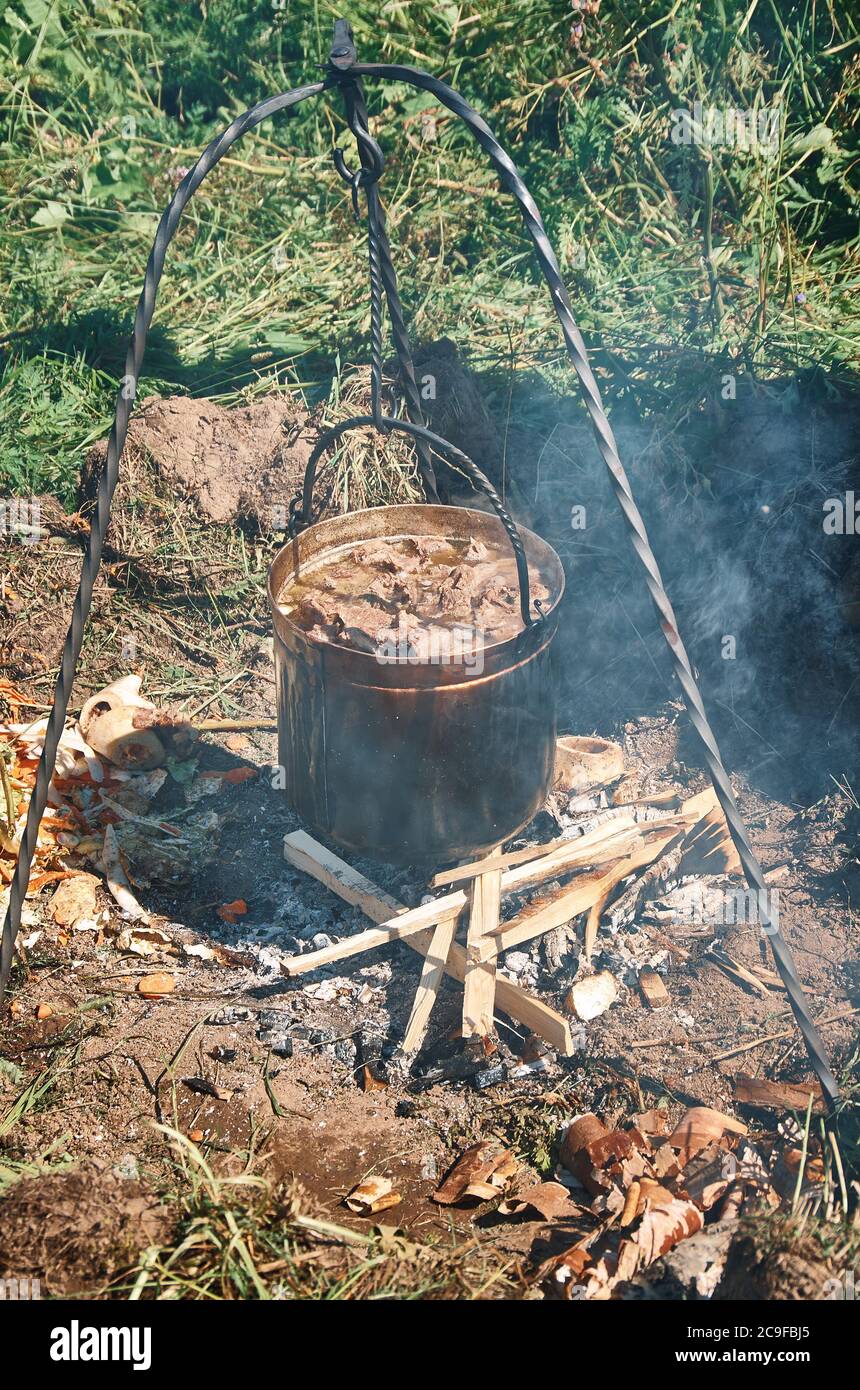 Cooking meat for in the kettle medieval dinner, Festival of historical ...