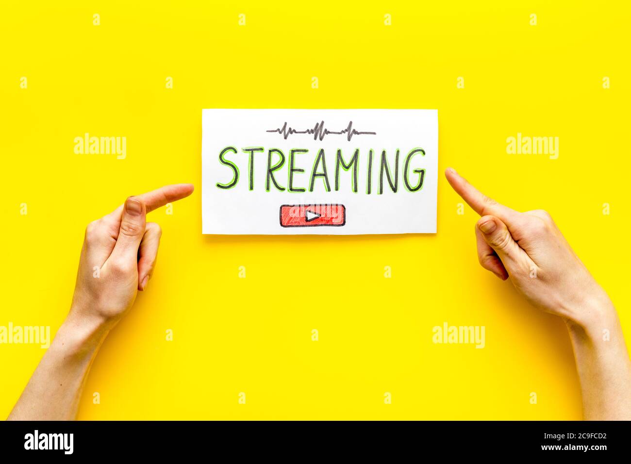 Live streaming web network concept. Female hands holding paper tablet ...