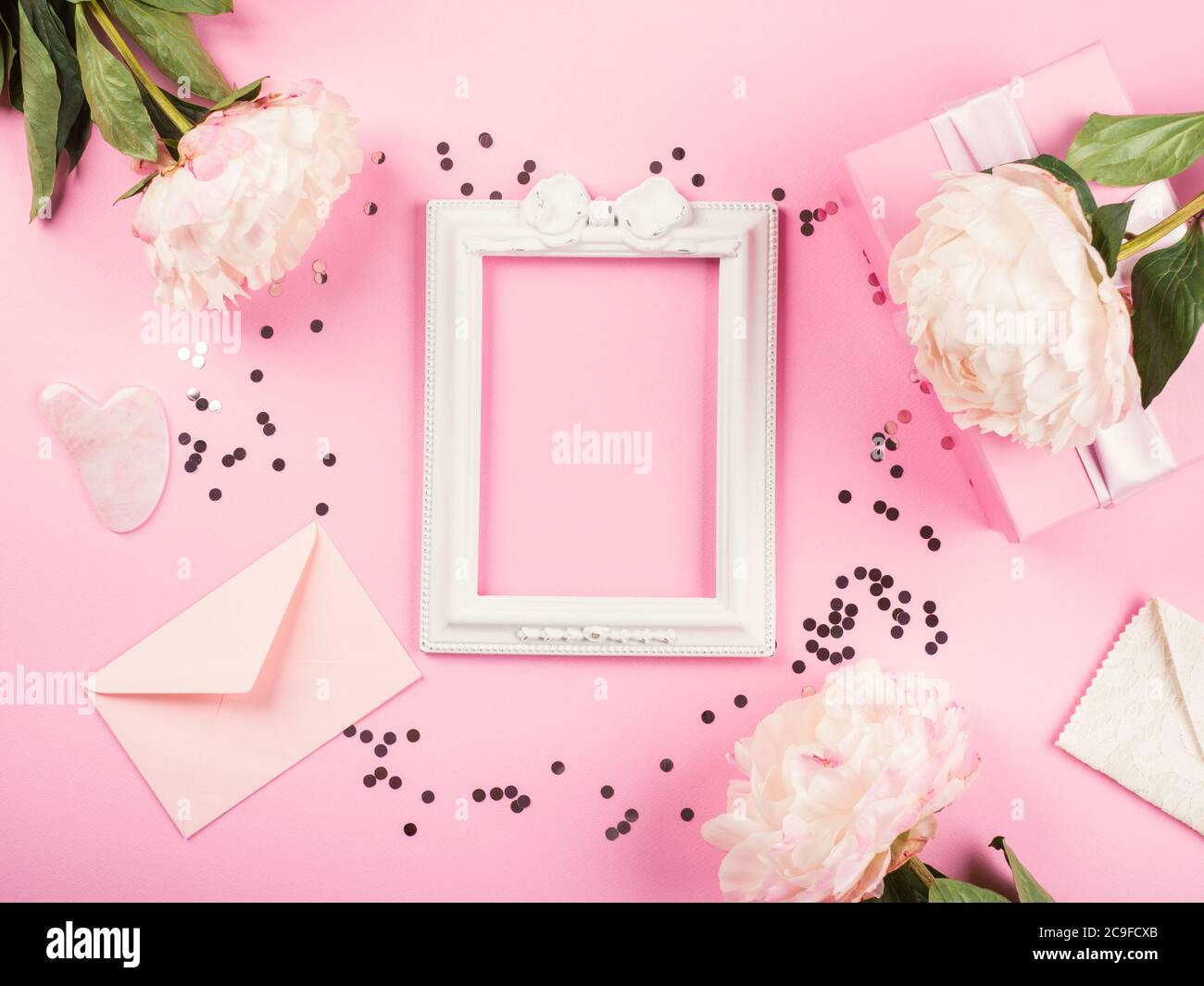 Pink pastel background with frame and flowers Stock Photo - Alamy