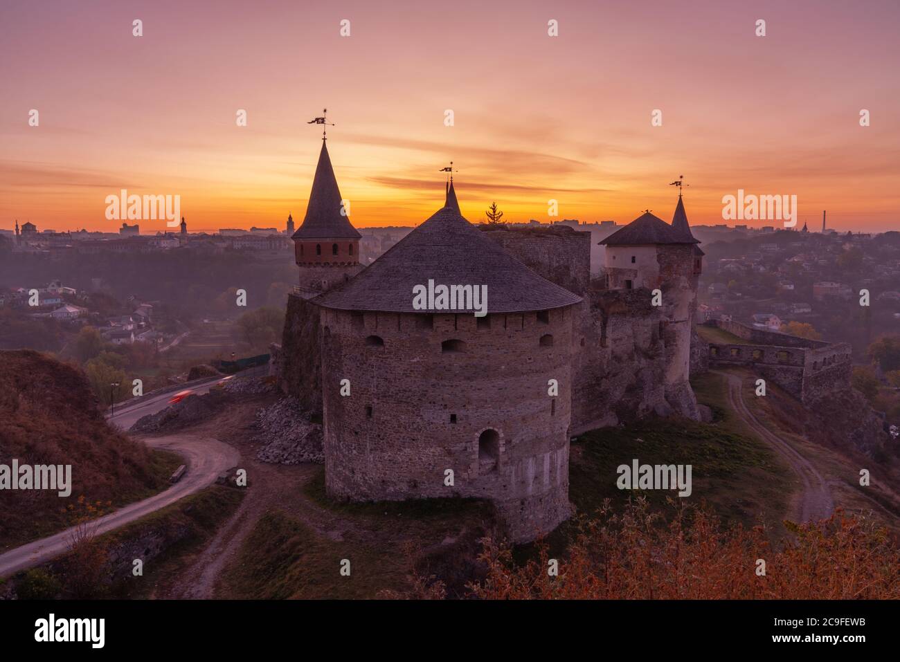 medieval castle or stronghold silhouette and beautiful sunset. Tourism ...
