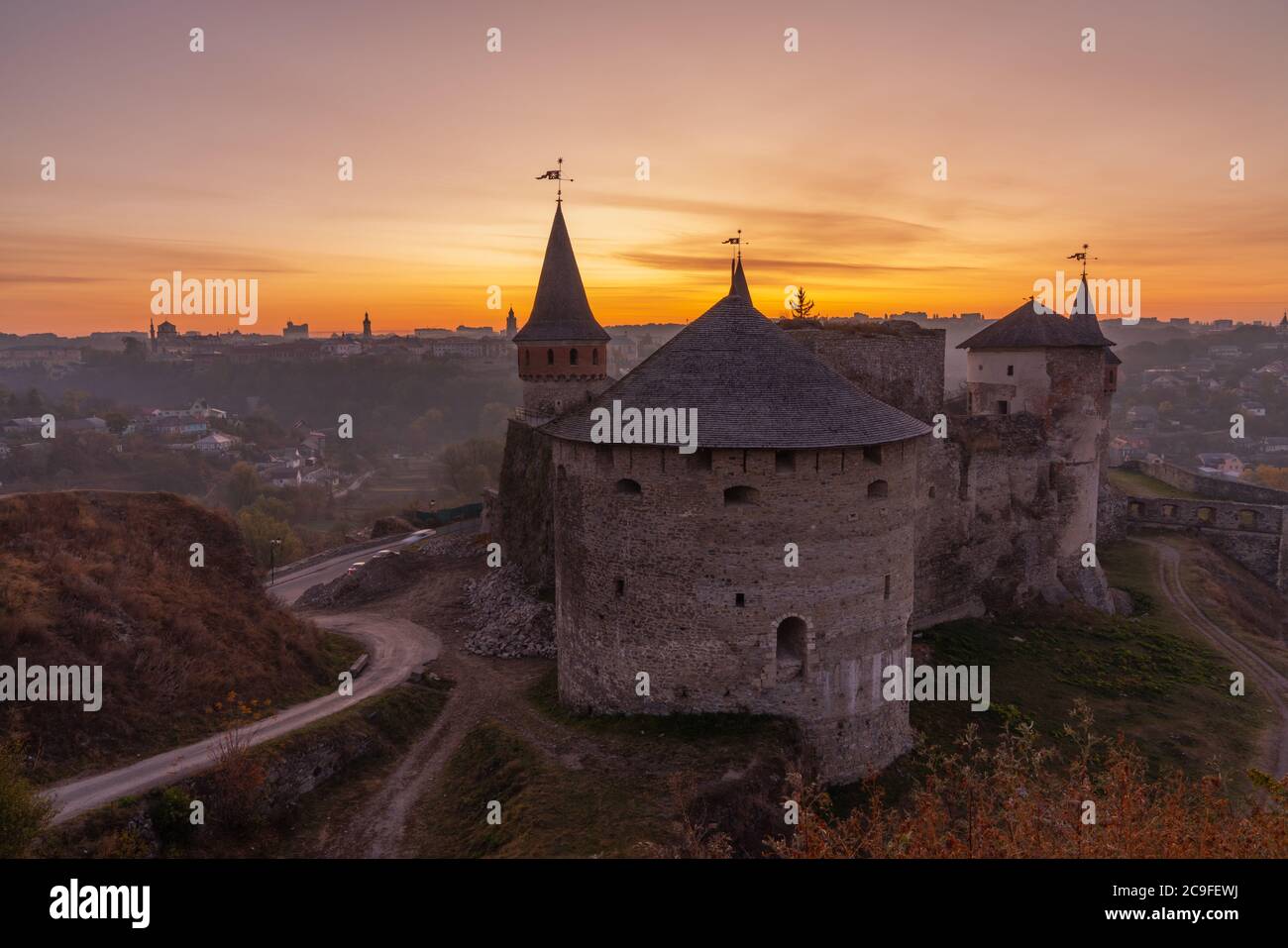 medieval castle or stronghold silhouette and beautiful sunset. Tourism ...
