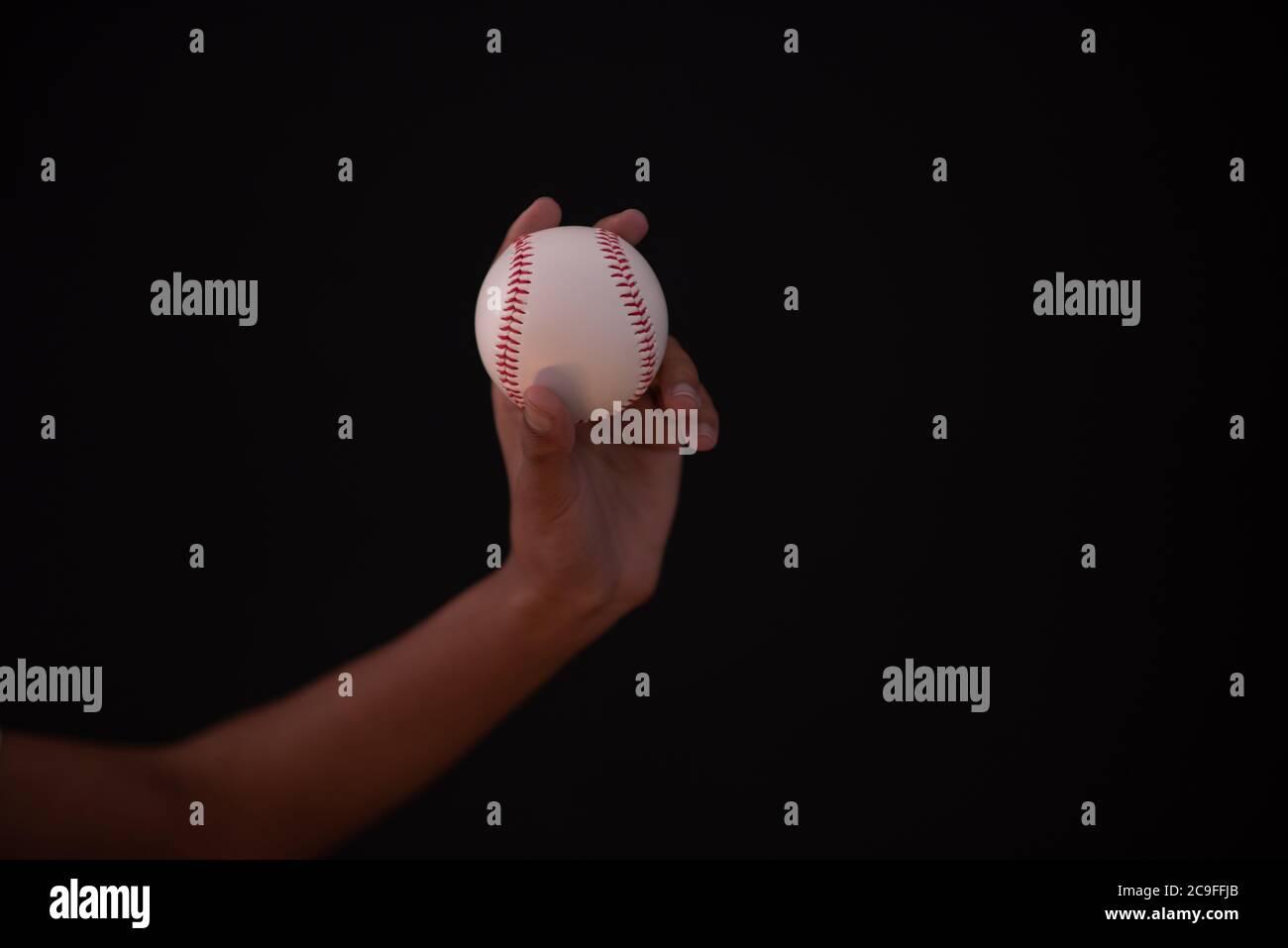 Person holding baseball in hand Stock Photo - Alamy