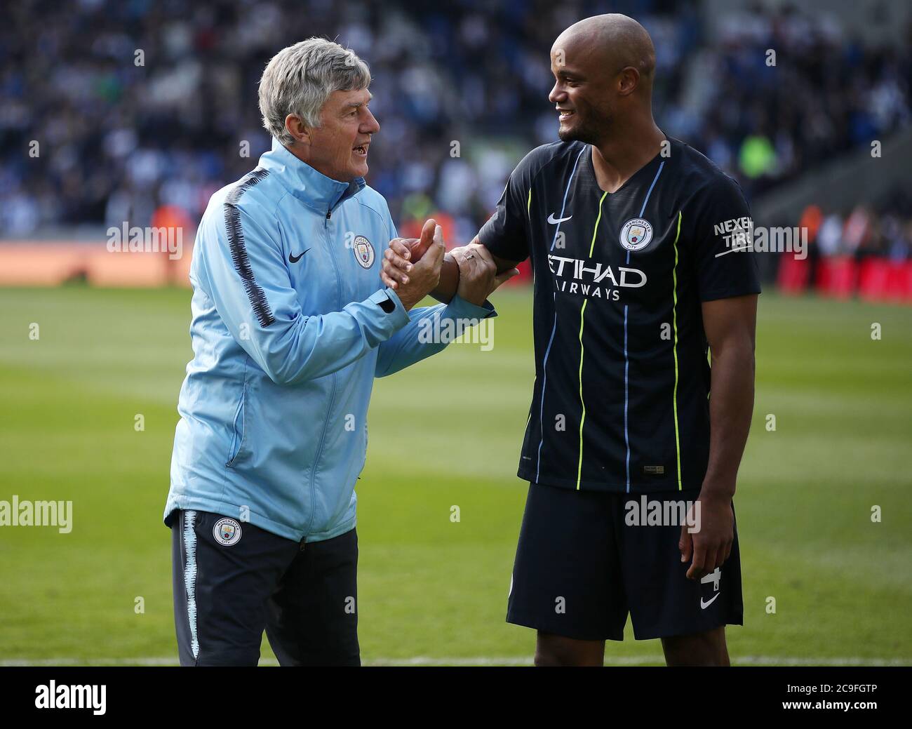 Manchester city coach brian kidd celebrates winning premier league hi ...