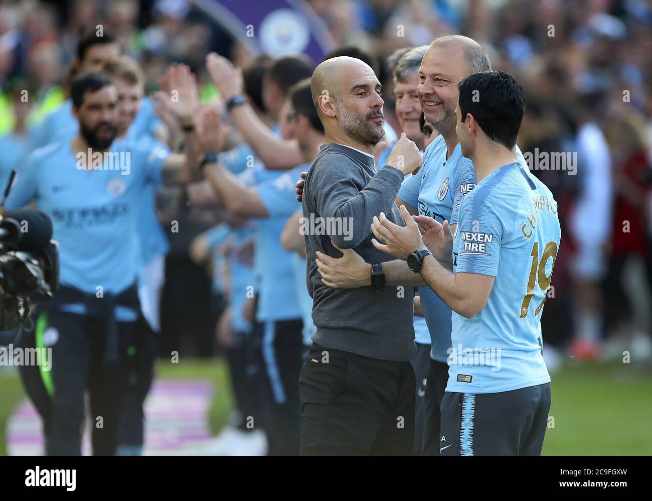 Manchester City manager Pep Guardiola hugs Manchester City Assistant ...