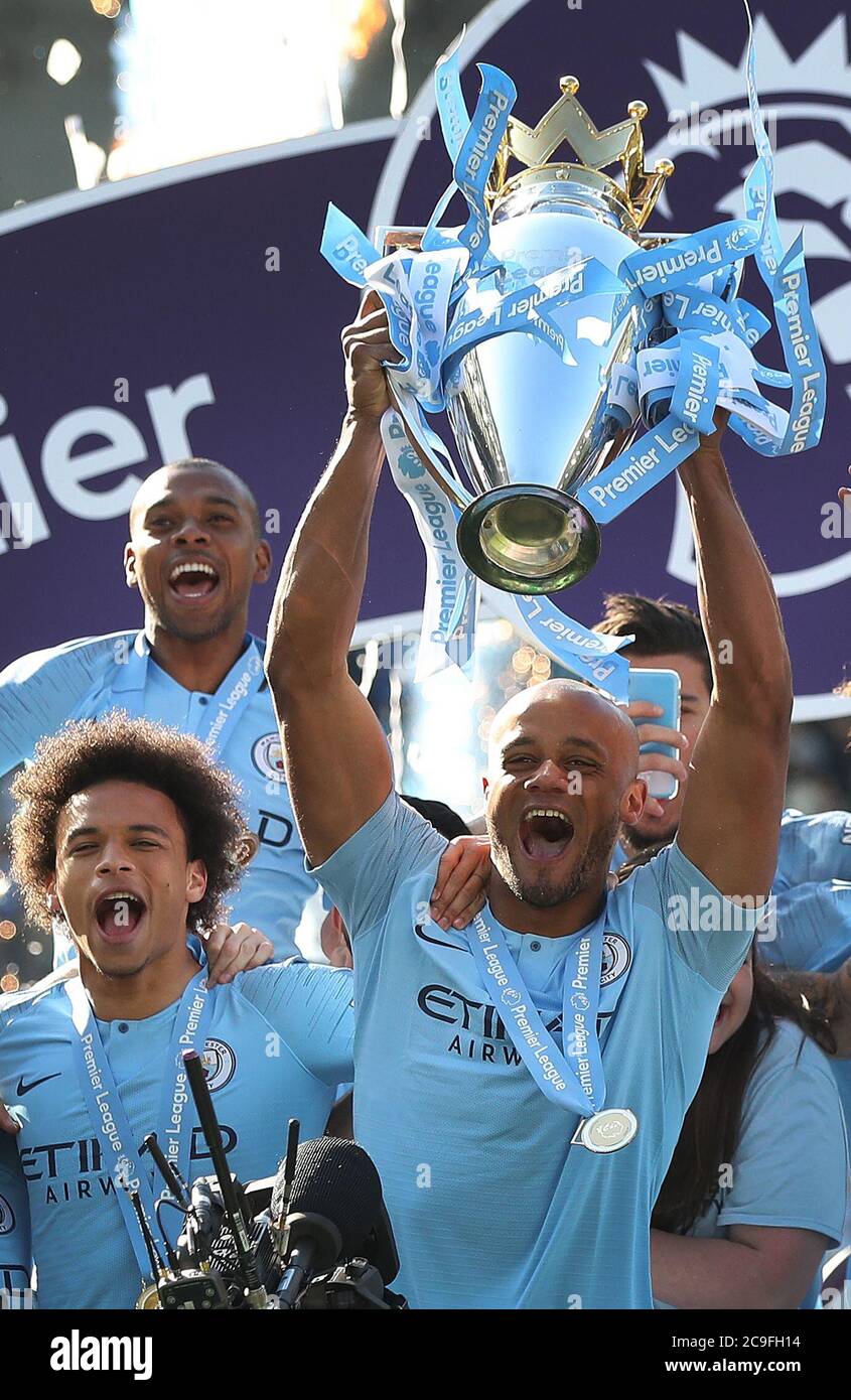 Manchester City captain Vincent Kompany lifts the Premier League Trophy ...