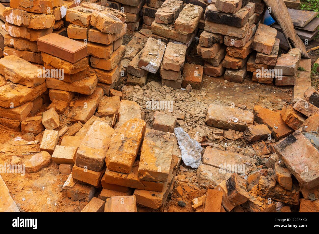 pile of red bricks at a construction site in the city. Repair ...