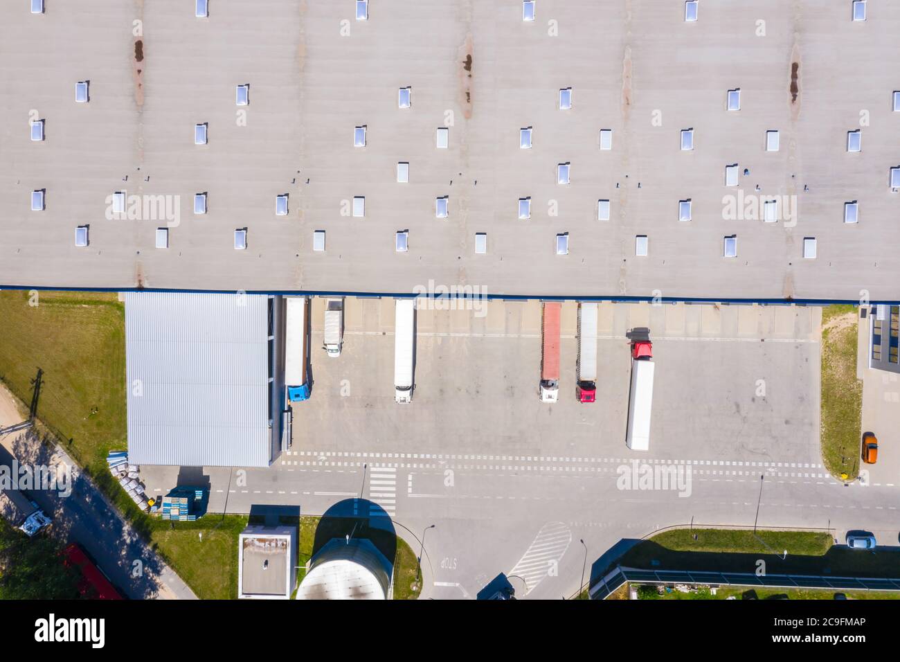 Aerial Shot of Industrial Warehouse Loading Dock where Many Truck with ...