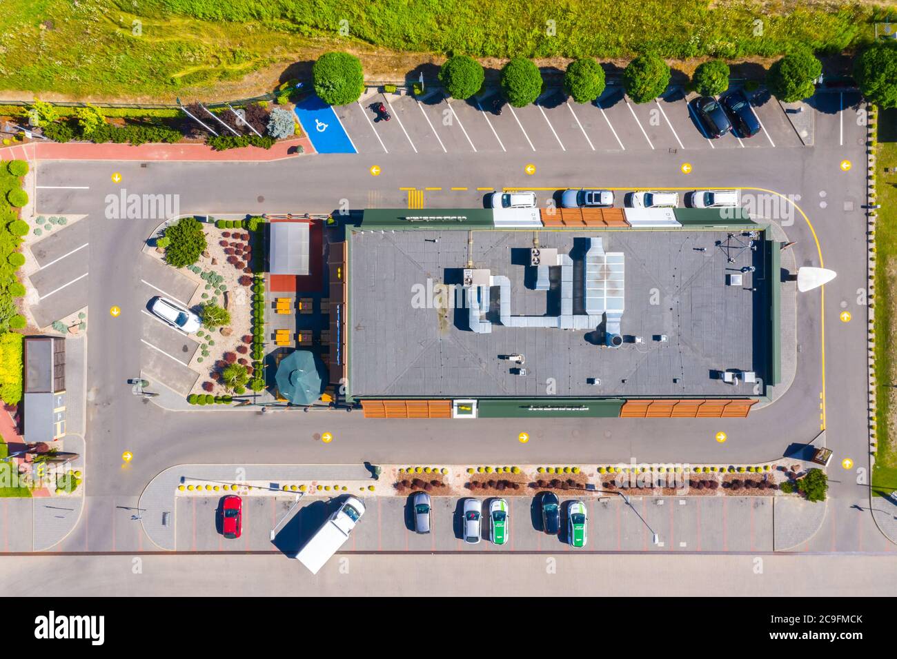 Fast food cafe restaurant and parking for cars. City parking lot with ...