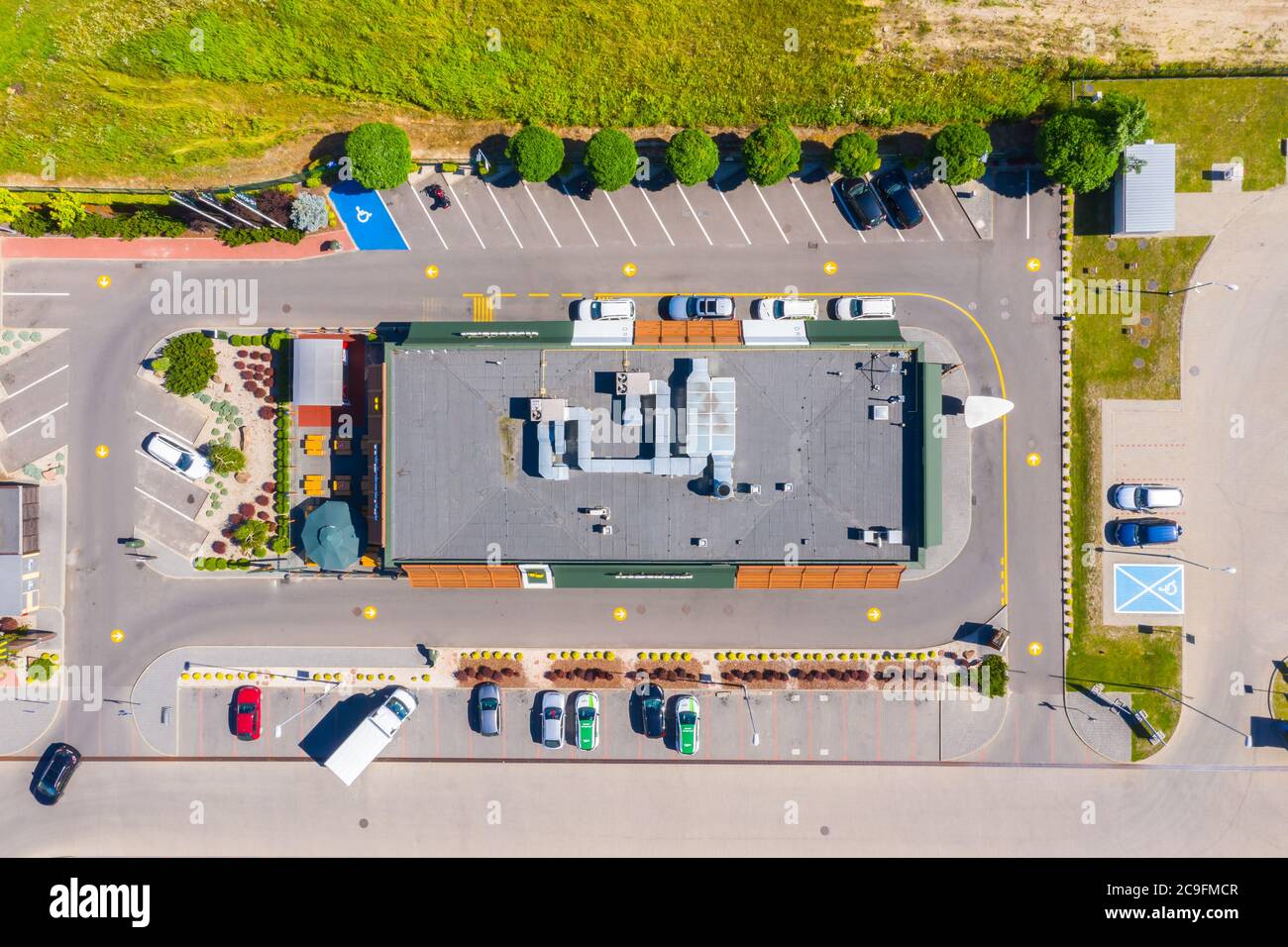 Fast food cafe restaurant and parking for cars. City parking lot with ...