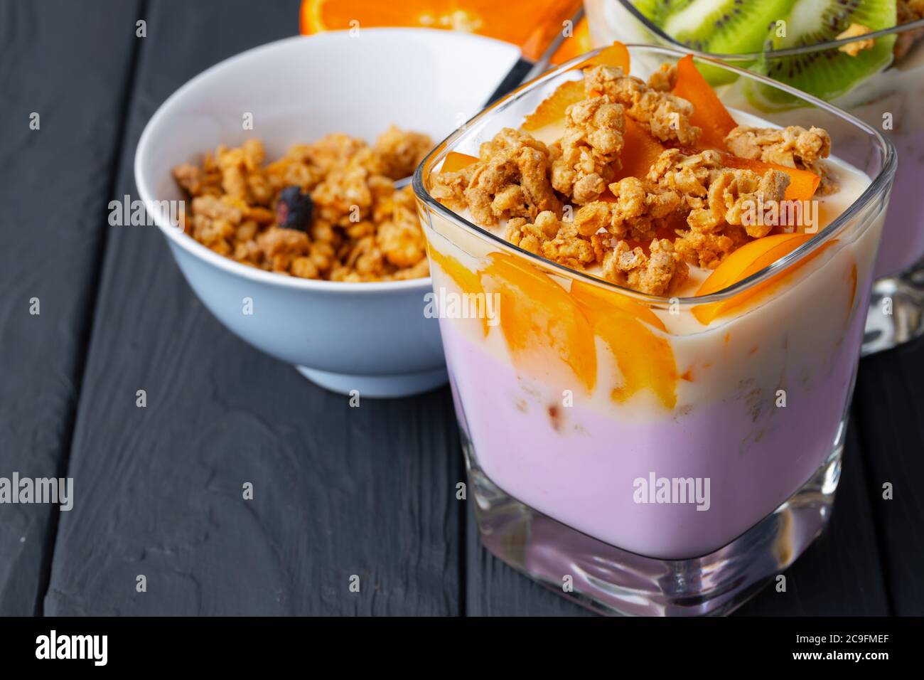 Berry youghurt with granola and fruits in a glass Stock Photo - Alamy