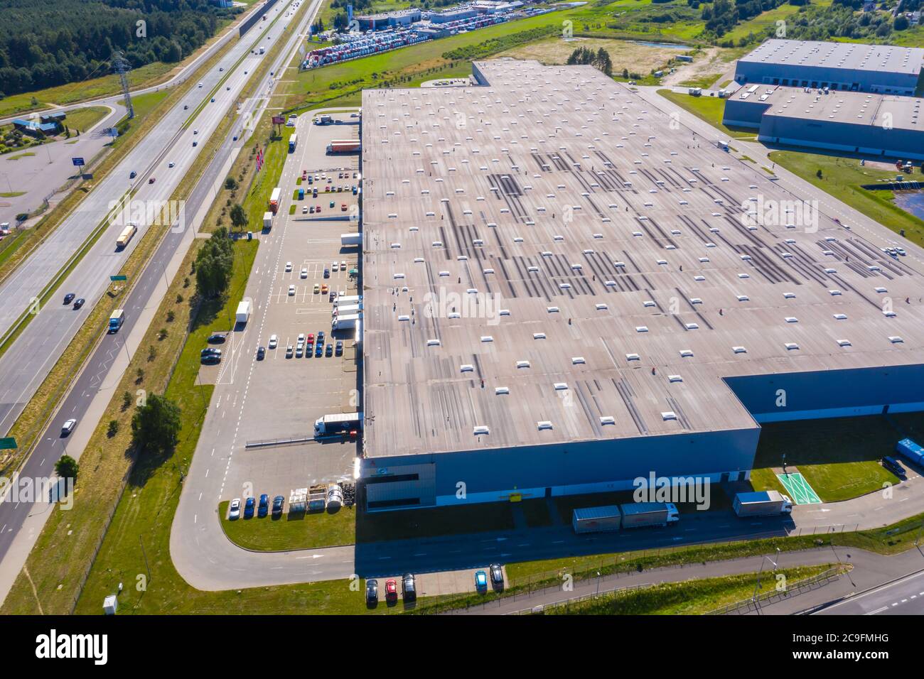 Aerial Shot of Industrial Loading Area where Many Trucks Are Unloading ...