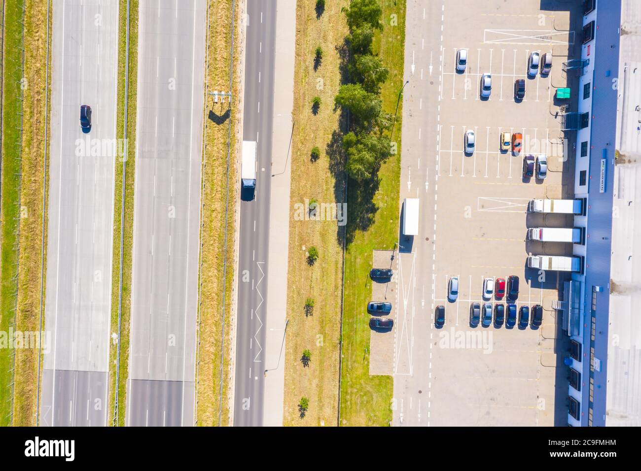 Aerial Shot of Industrial Loading Area where Many Trucks Are Unloading ...