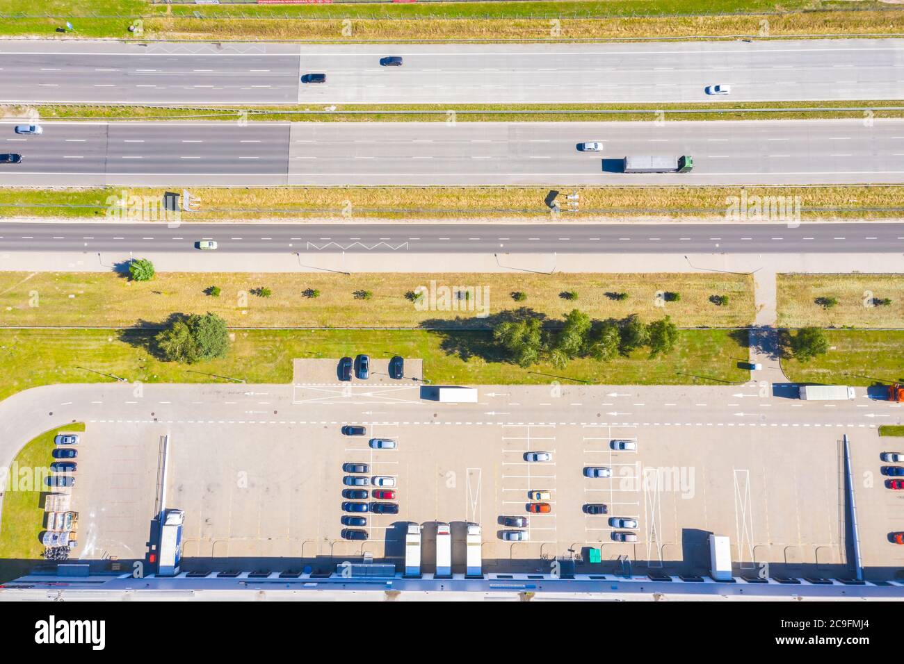 Aerial Shot of Industrial Loading Area where Many Trucks Are Unloading ...