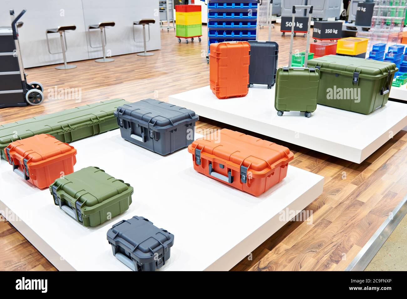 Color plastic tools boxes in hardware store Stock Photo - Alamy