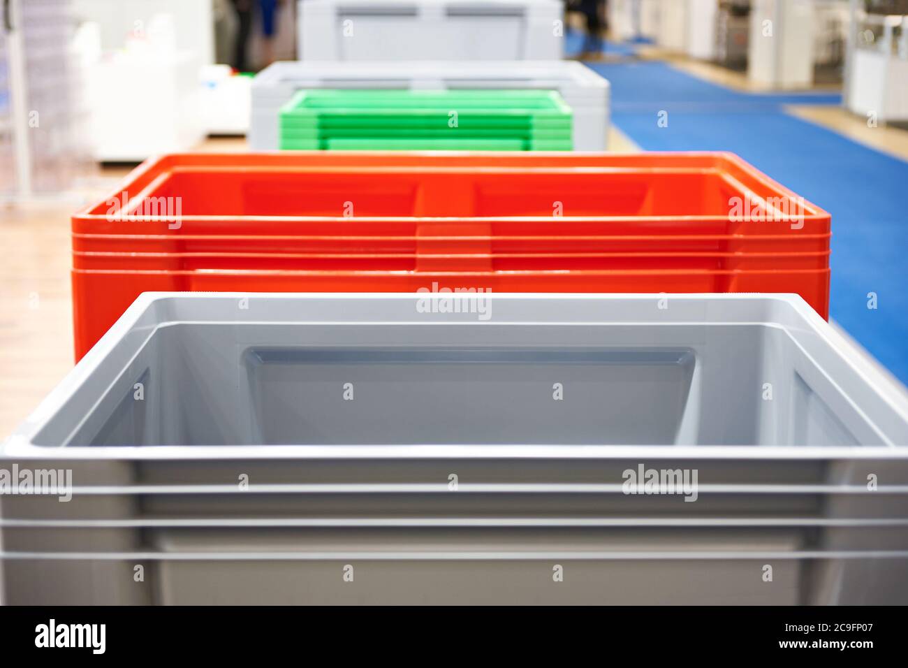 Color plastic tools boxes in hardware store Stock Photo - Alamy