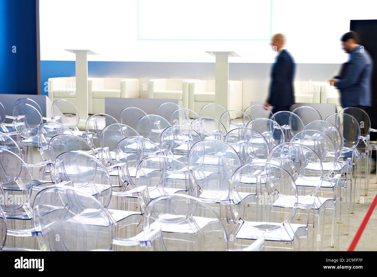 Transparent plastic chairs in the conference room and people Stock ...