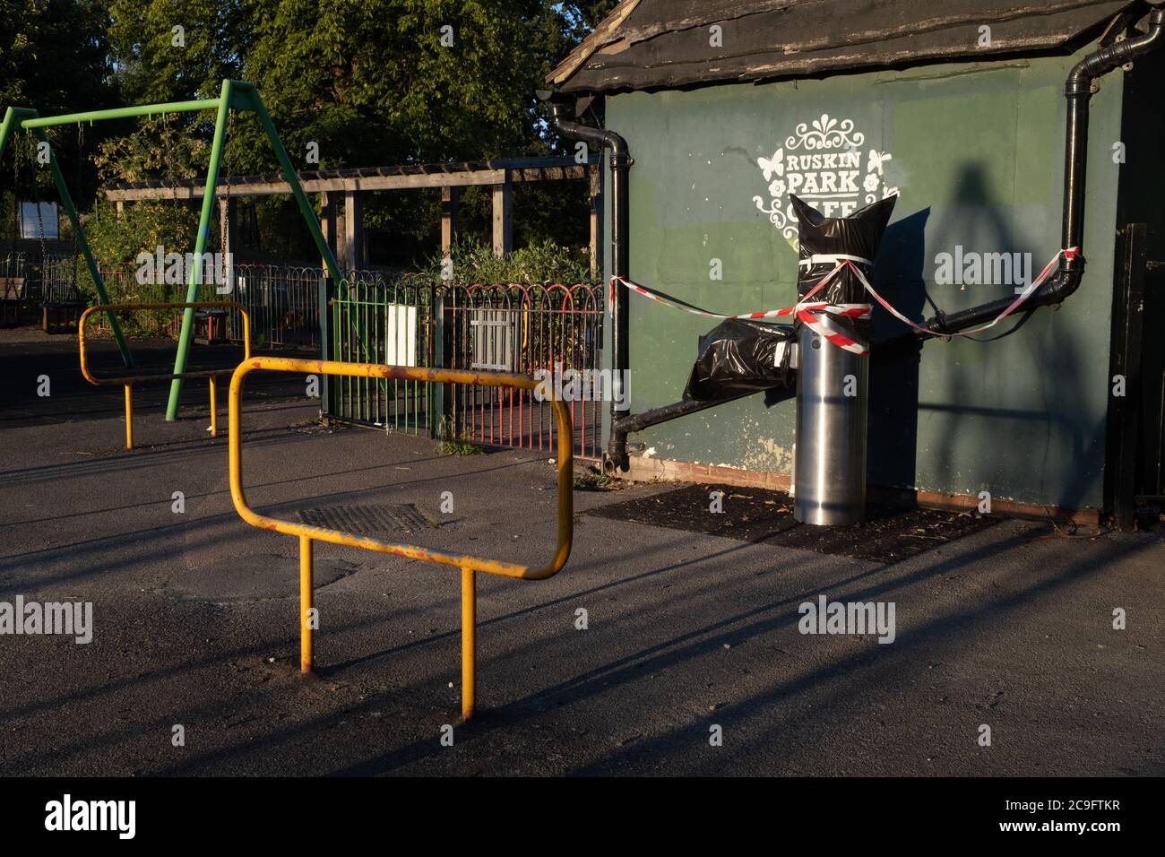 Dawn sunshine in the playground at Ruskin Park, on 30th July 2020, in ...
