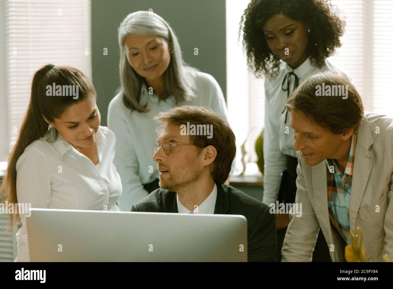 Diverse office team working together. Group of multi-ethnic business ...