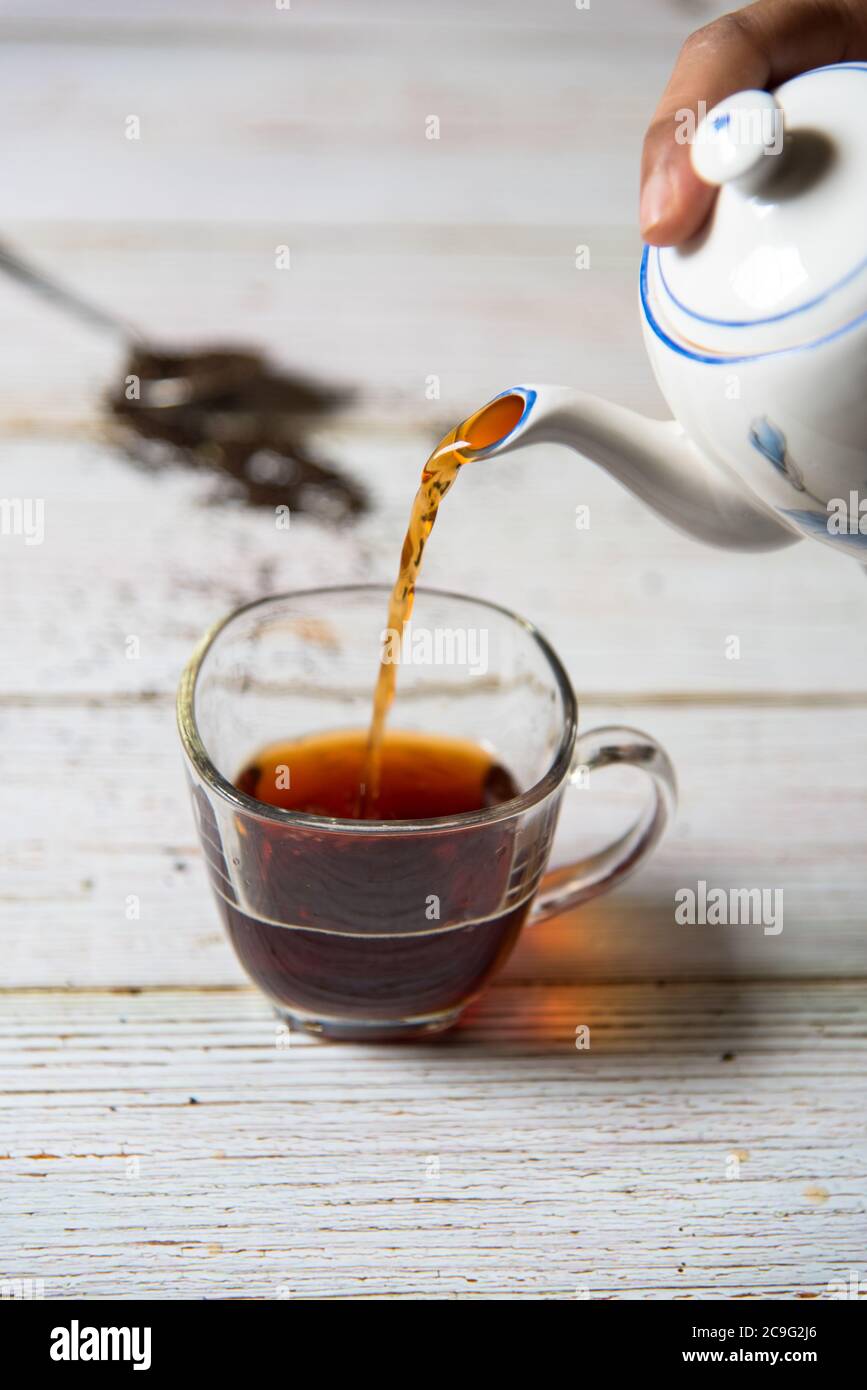 Tea pot pouring tea cup hi-res stock photography and images - Alamy