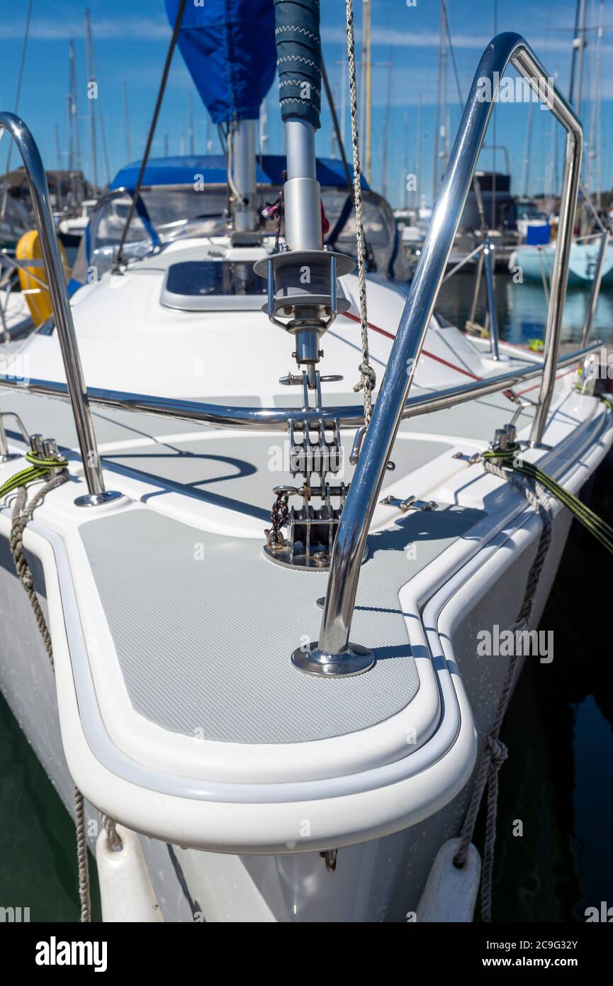 Bow of a sailing yacht moored in a marina. Ropes and sails Stock Photo ...