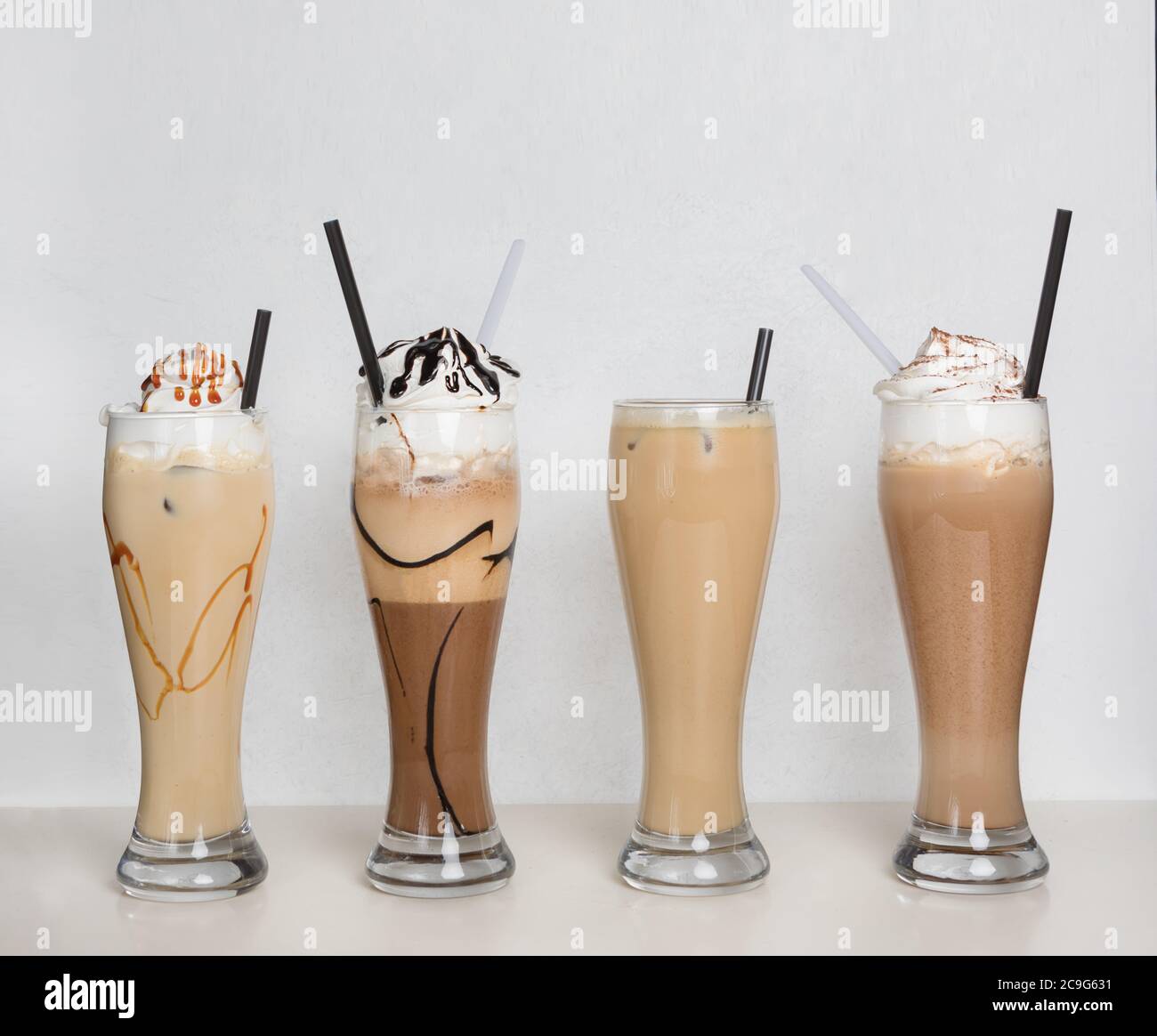 Fruit milky cocktails on a isolated white background Stock Photo - Alamy