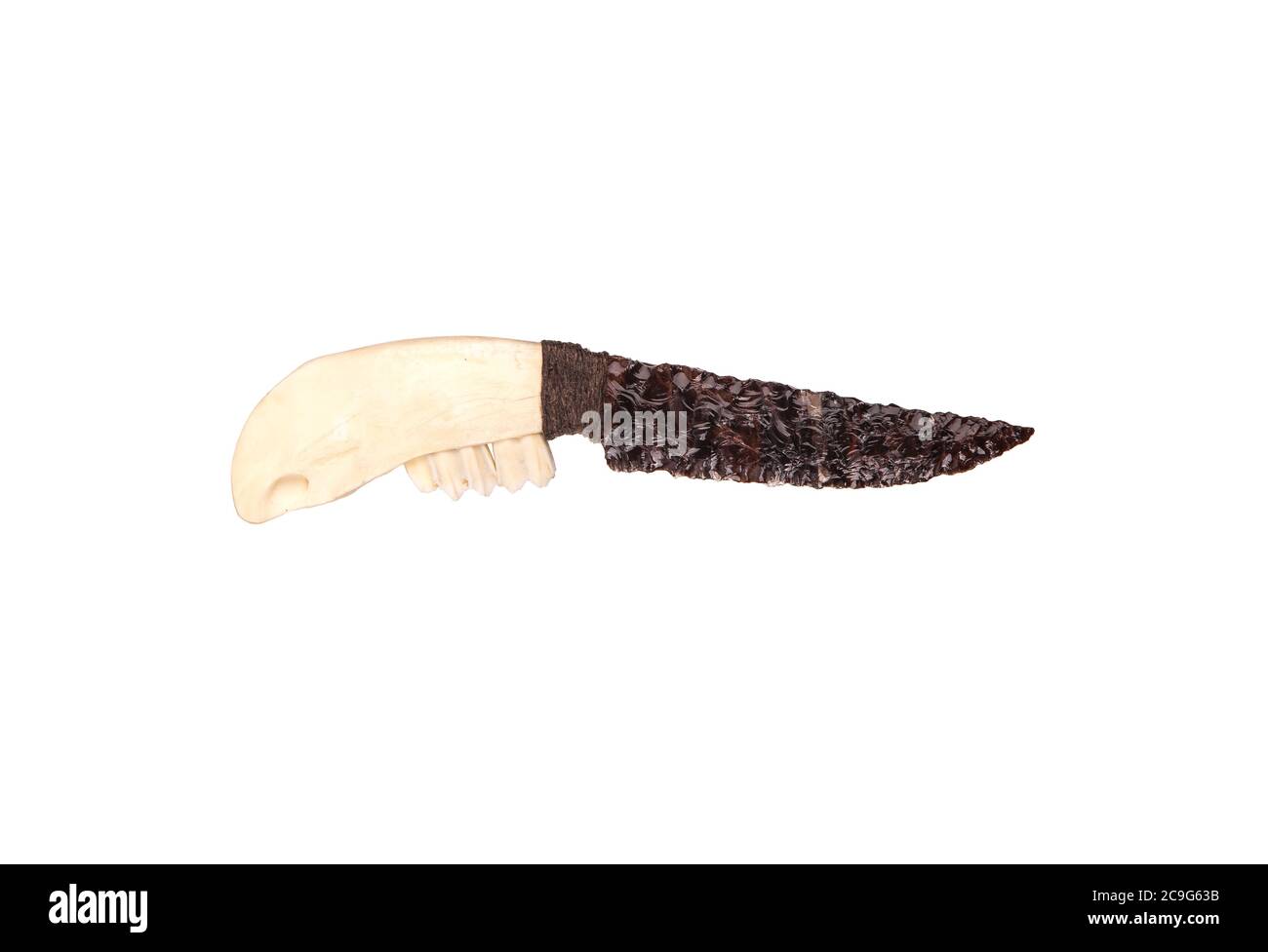 Obsidian knife with bone handle isolate on a white background ...