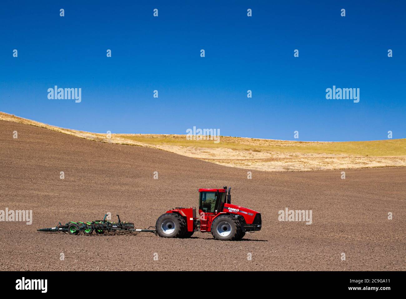 Red Case tractor in a field of the Palouse farming district of eastern ...