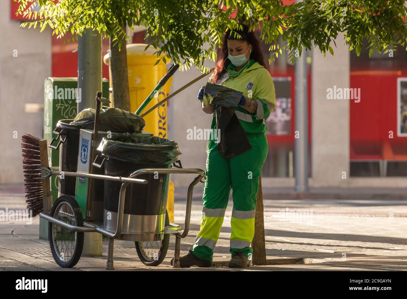 Female city street sweeper in hi-res stock photography and images - Alamy