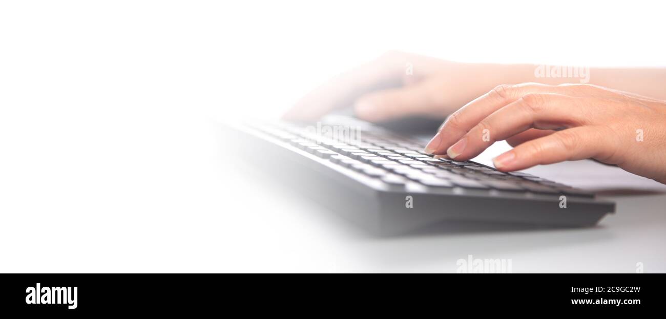 Detail of female fingers typing on keyboard. With selective focus. Copy ...