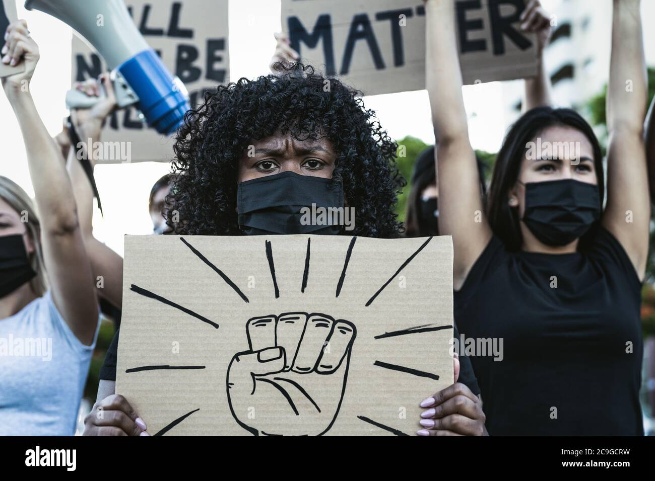 Racial equality fist hi-res stock photography and images - Alamy