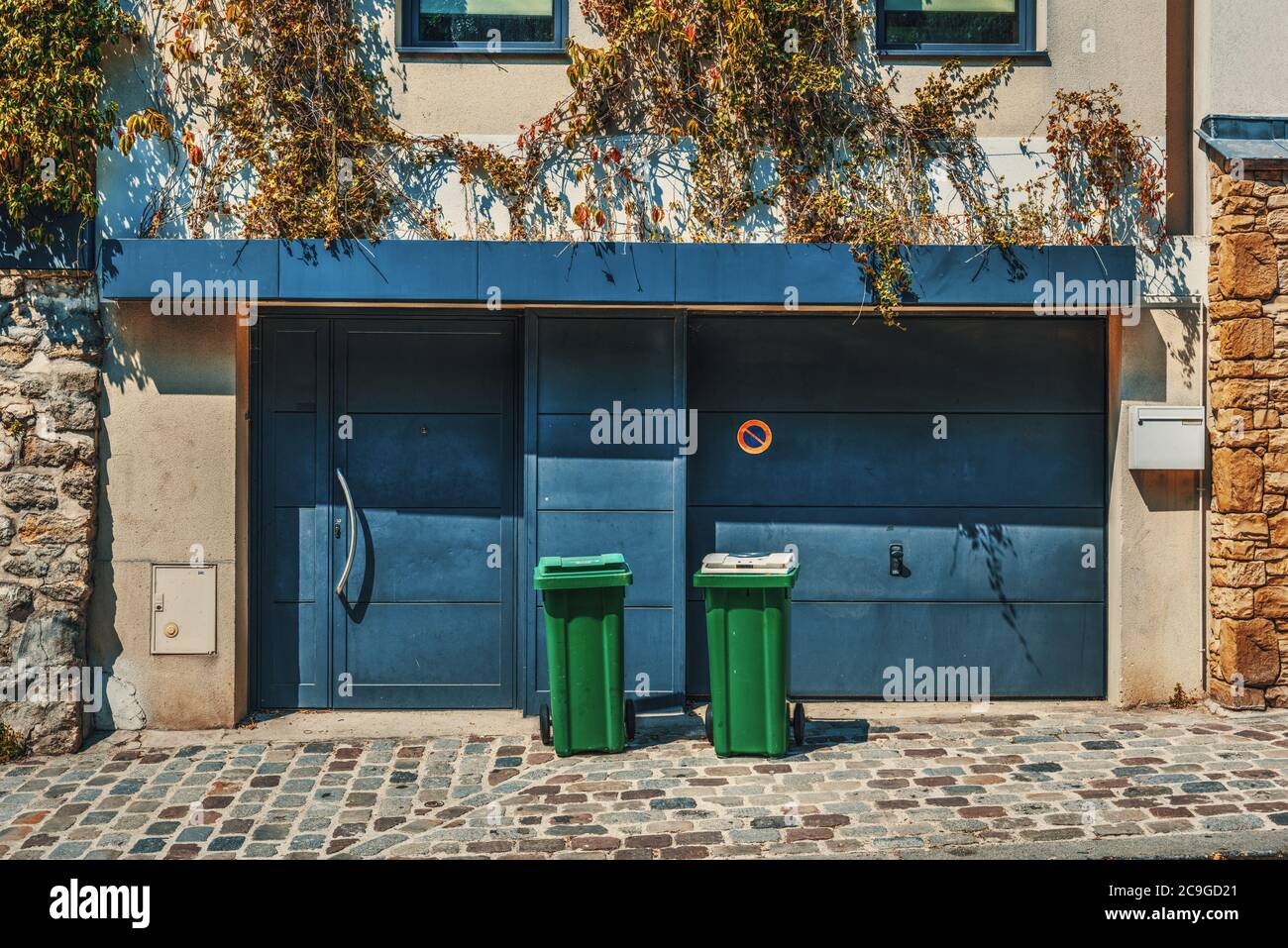 Trash cans and garage doors in a luxury building in Paris, France Stock ...