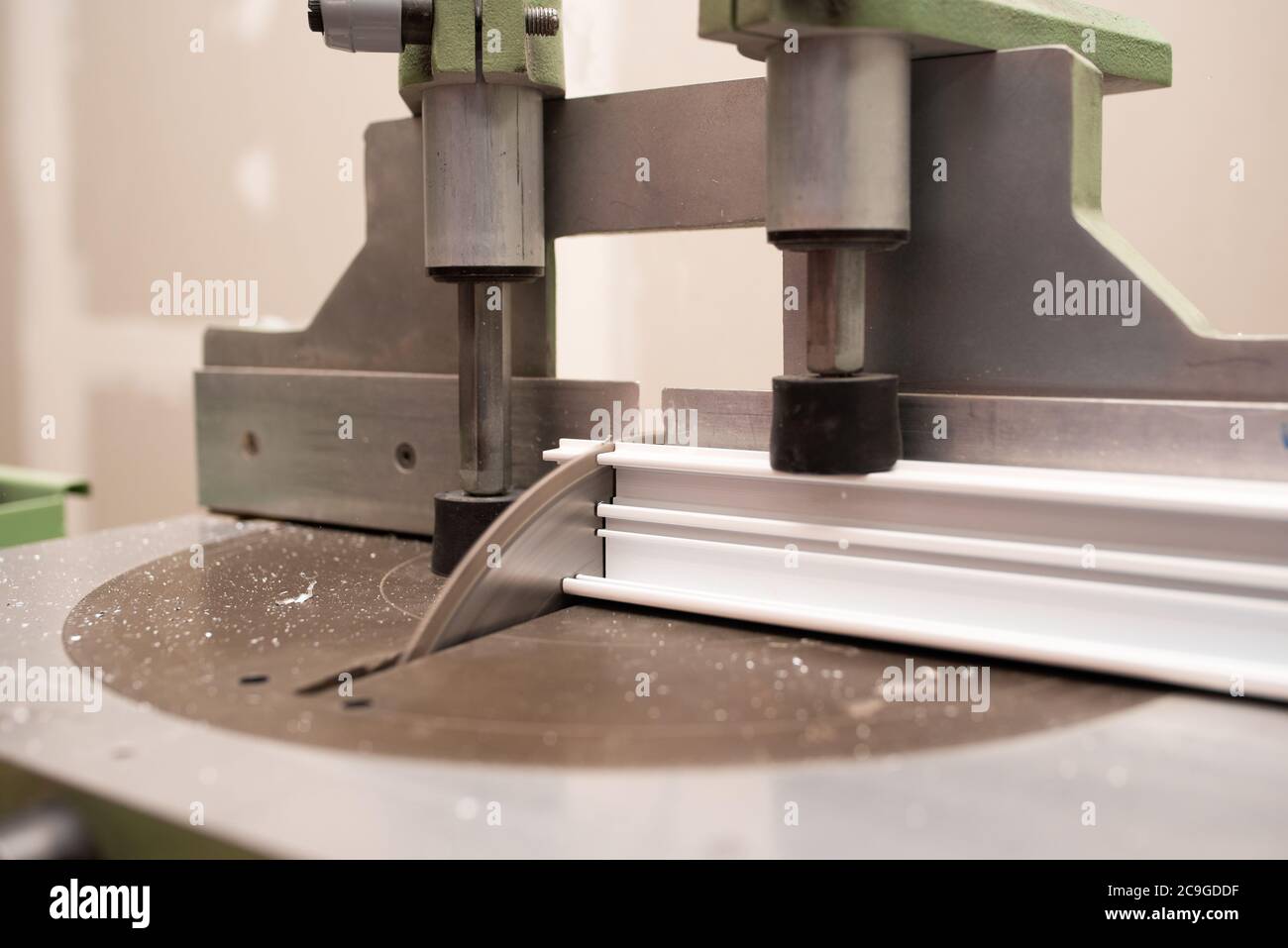Big cutting machine cutting a long metallic pipe into smaller pieces ...