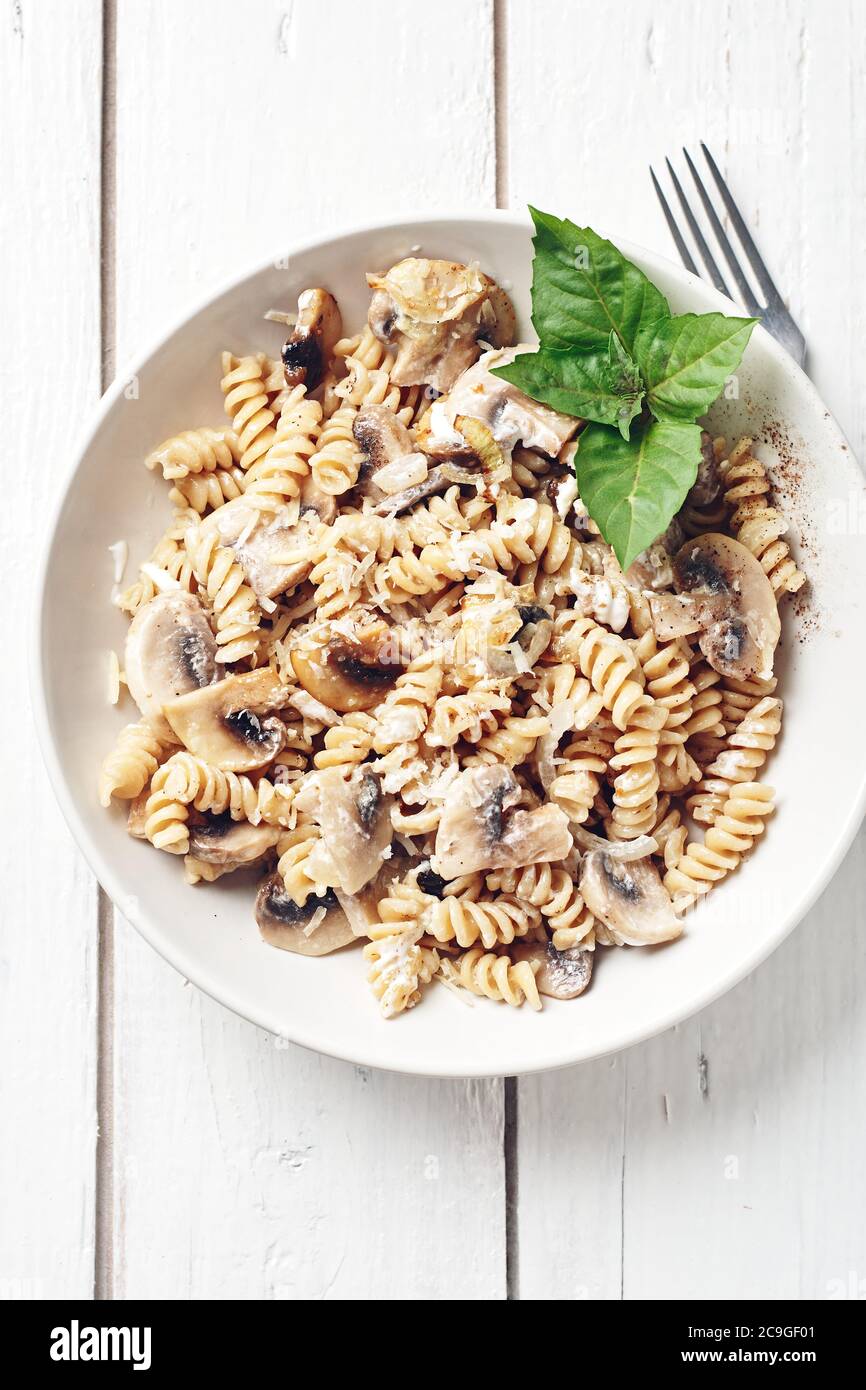 Fusilli pasta with mushrooms and cheese Stock Photo - Alamy