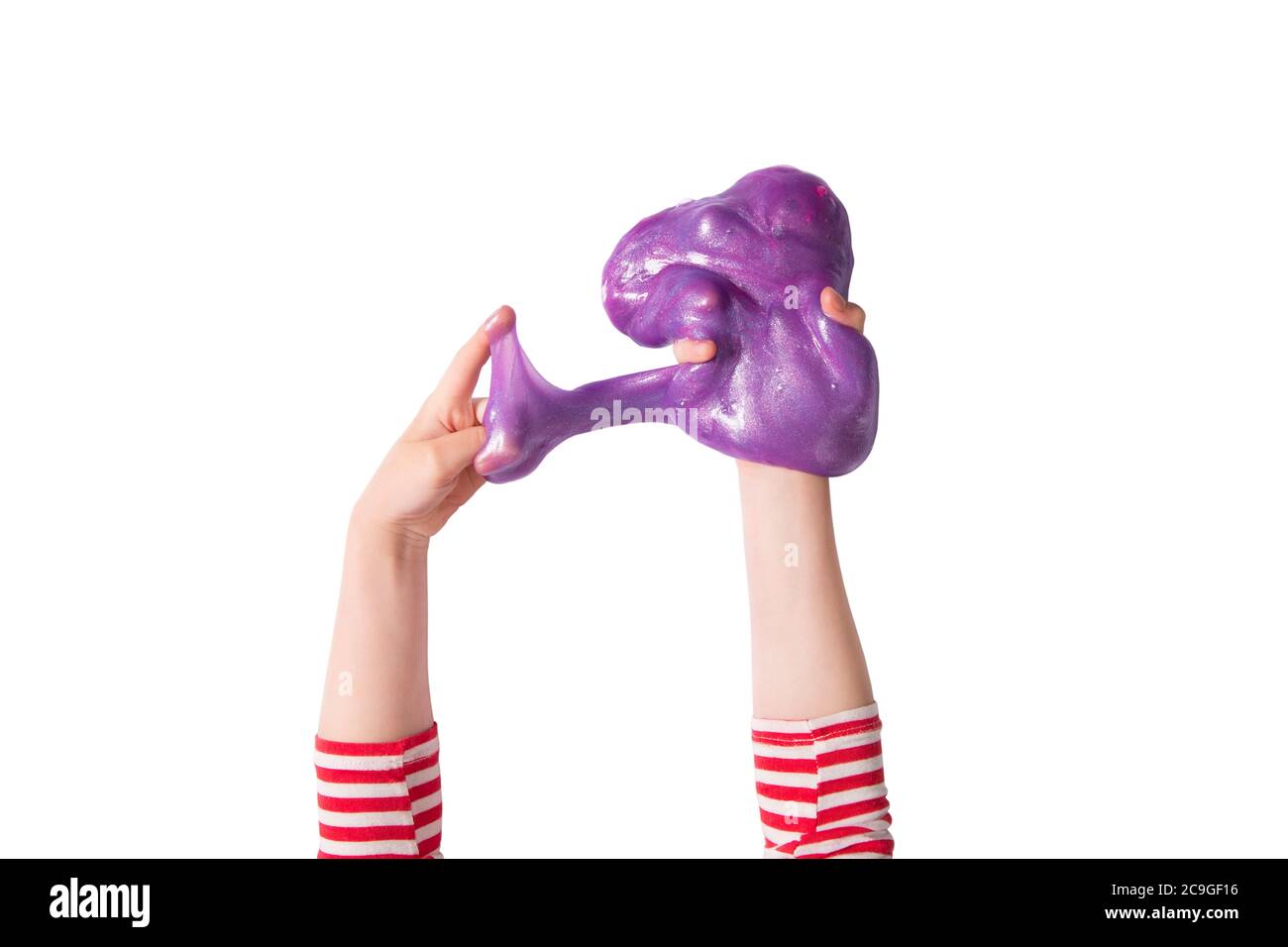 Teenager girl hands and purple shiny slime. Child girl plays with slime ...